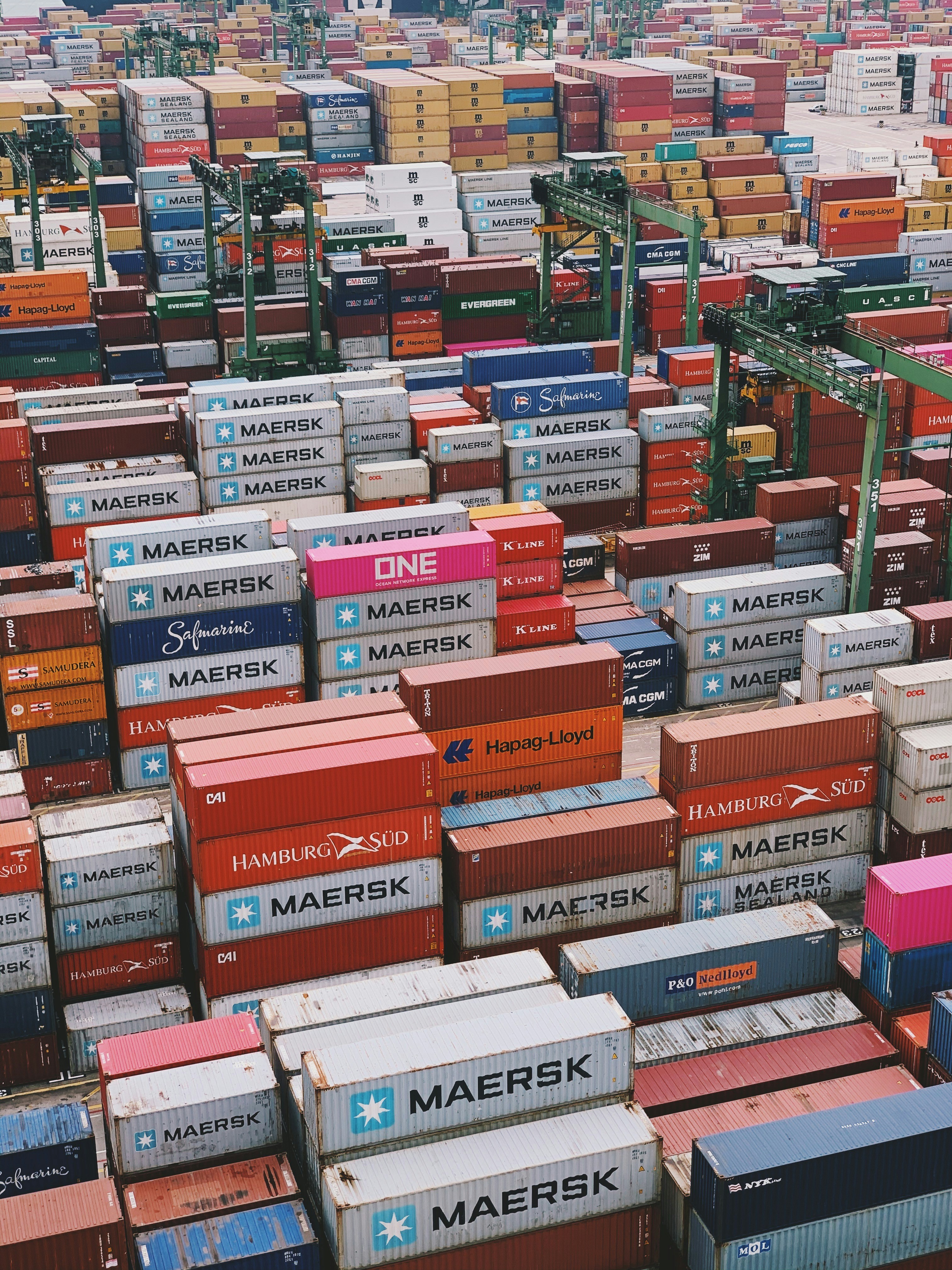 A large amount of shipping containers stacked on top of each other ...