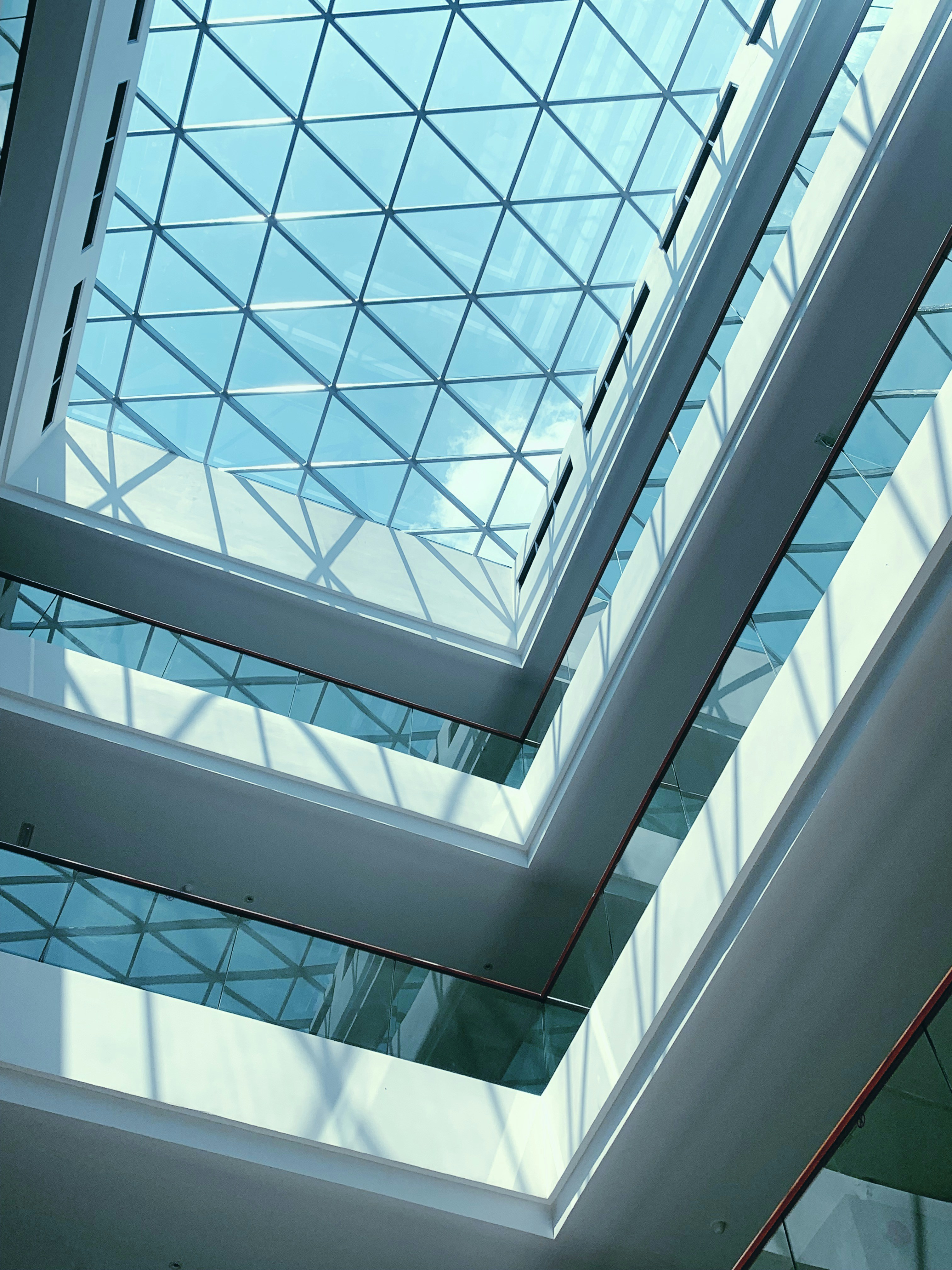 A view of a glass ceiling in a building photo – Free Building Image on ...