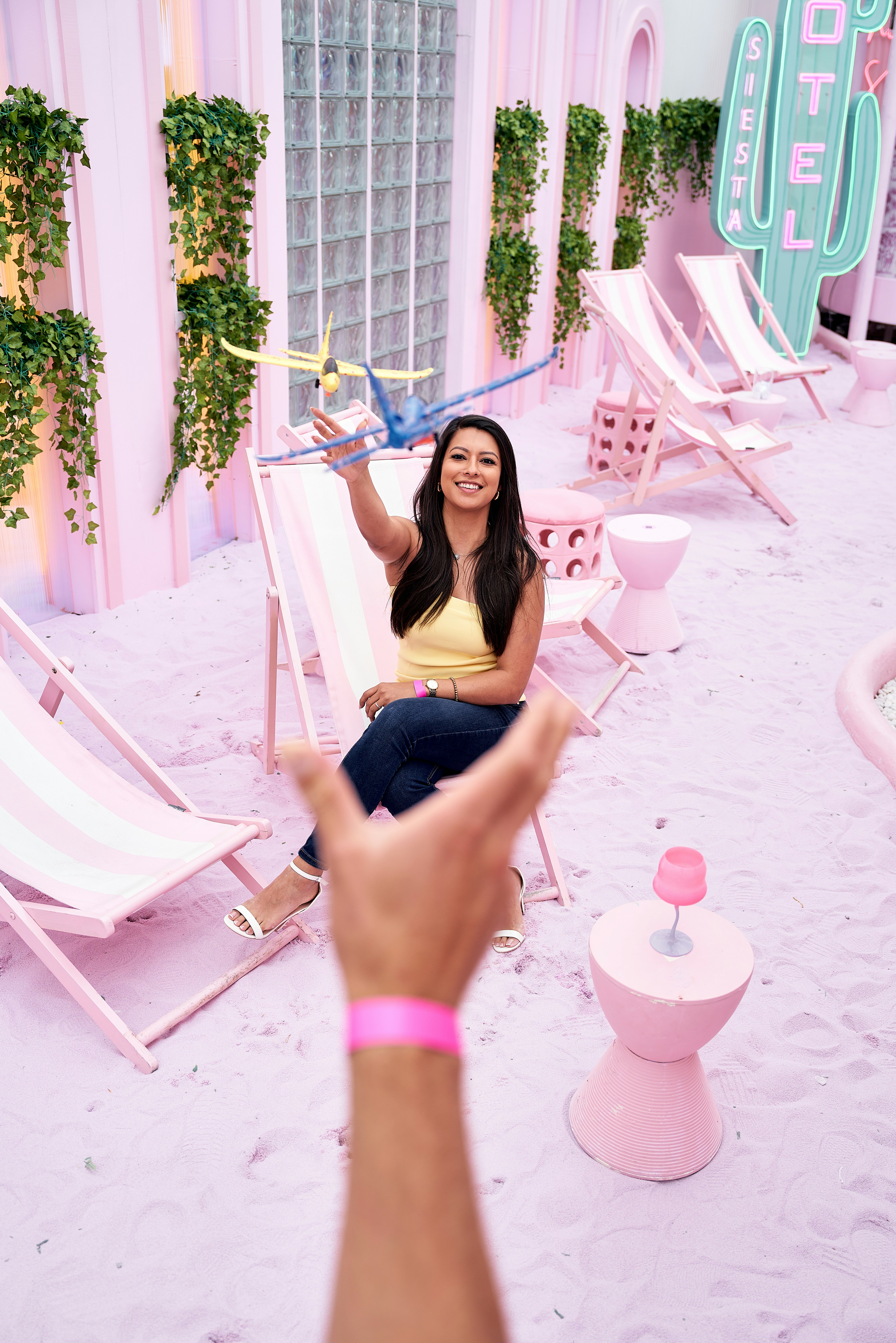 Sunlit Portrait in a Neon-Pink Oasis