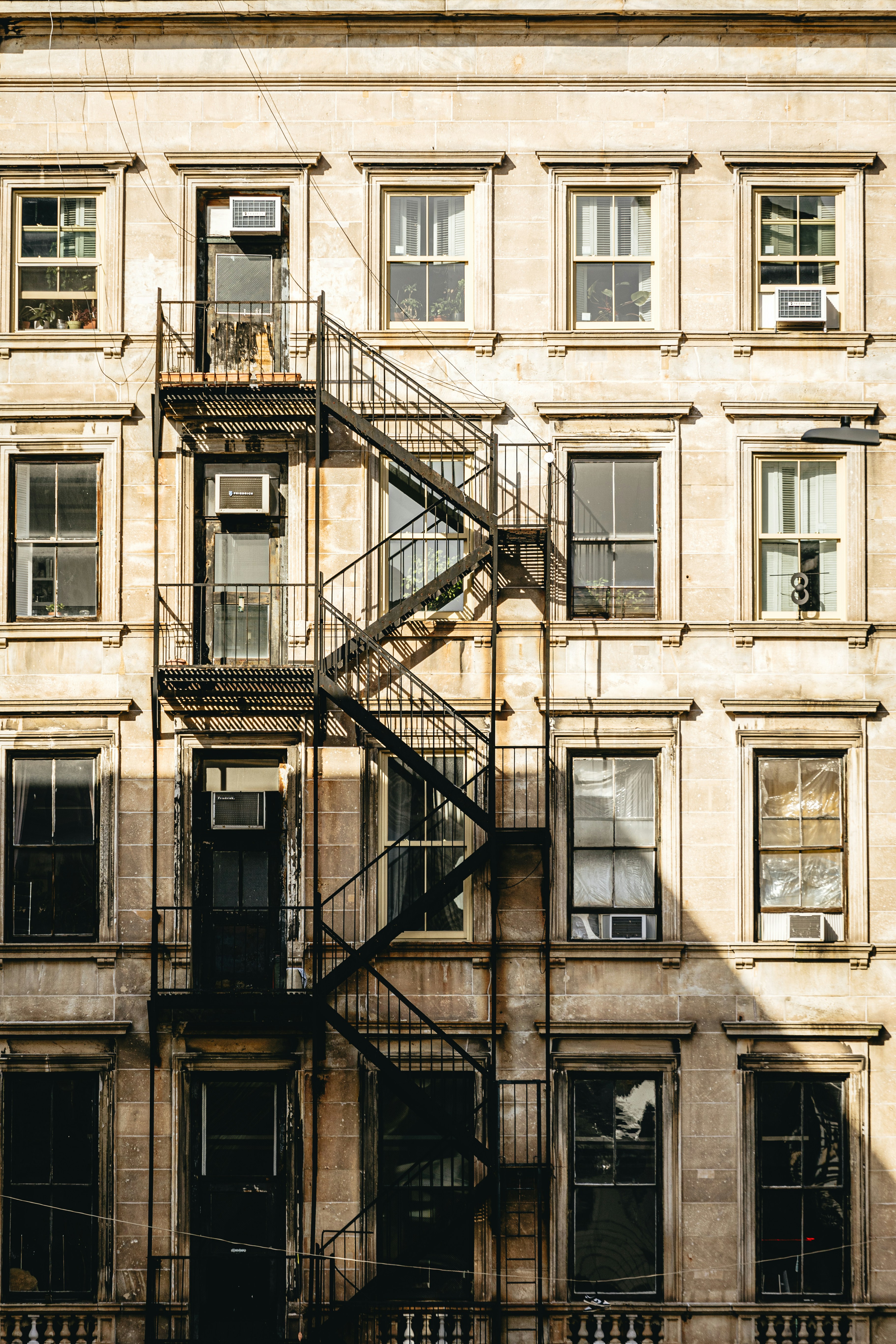 A fire escape on the side of a building photo – Free Cityscape Image on ...