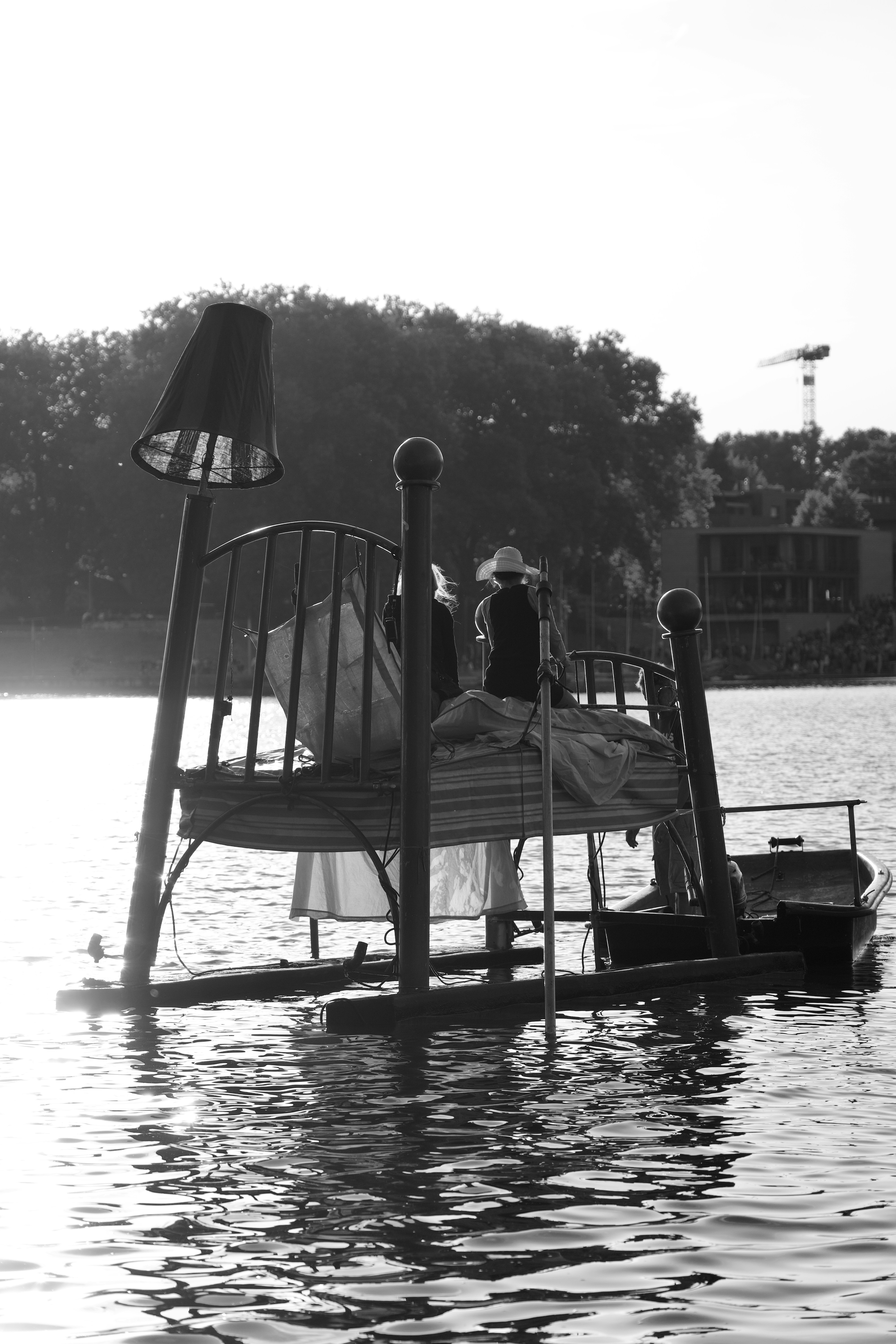 A couple of people sitting on a boat in the water