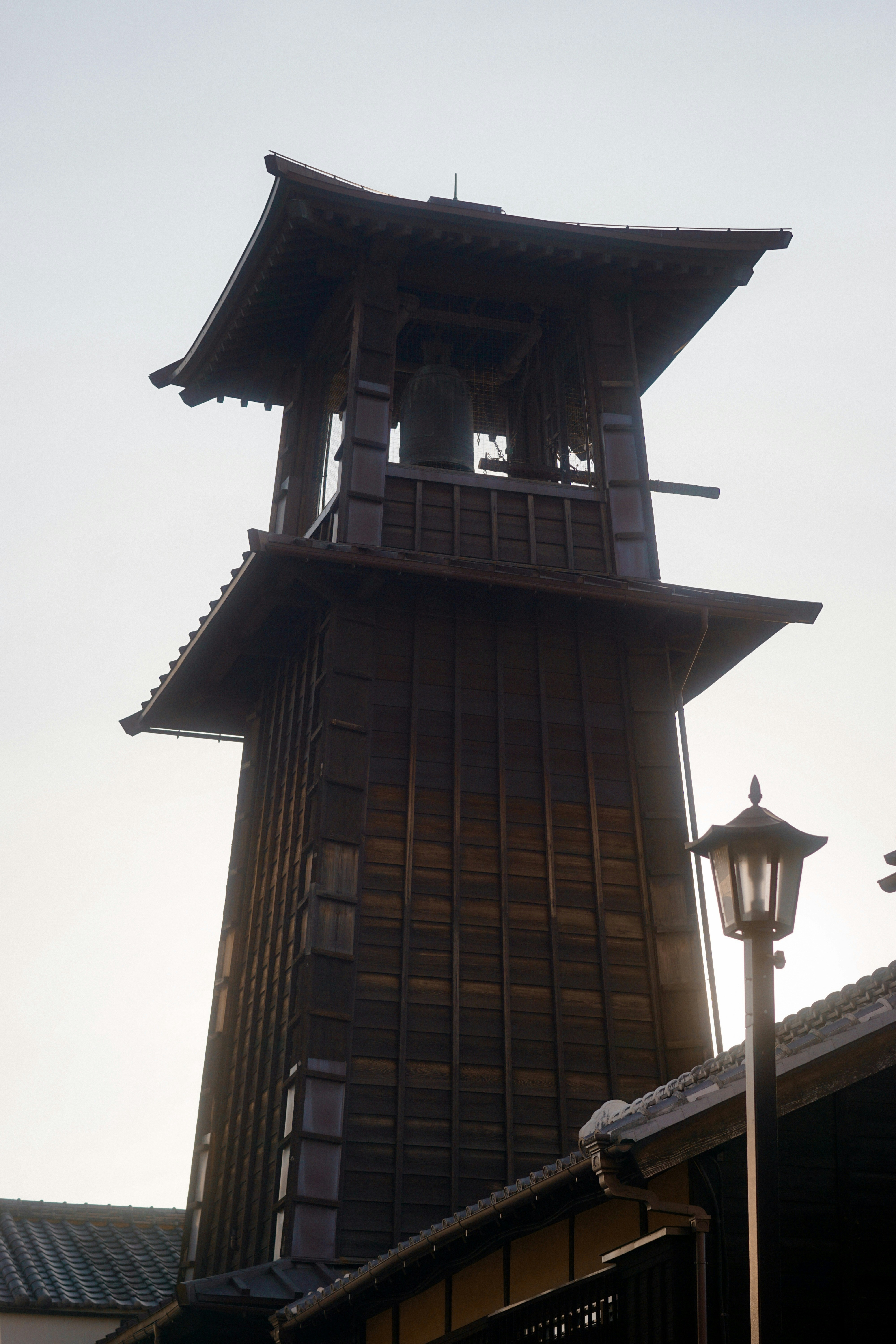 Timber Bell Tower Rising Against a Pale Dusk Sky