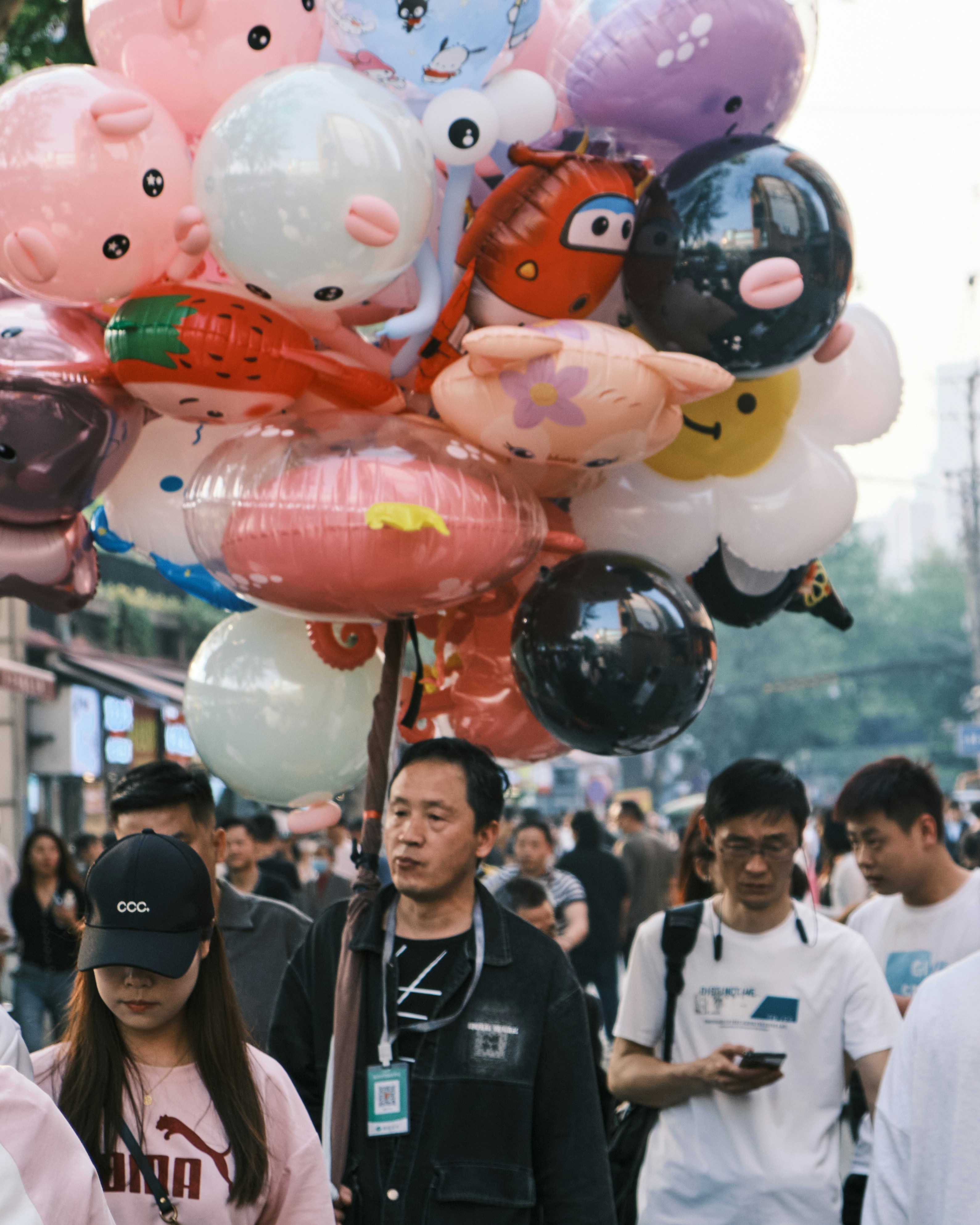Balloon Cavalcade Over a Bustling Street Market