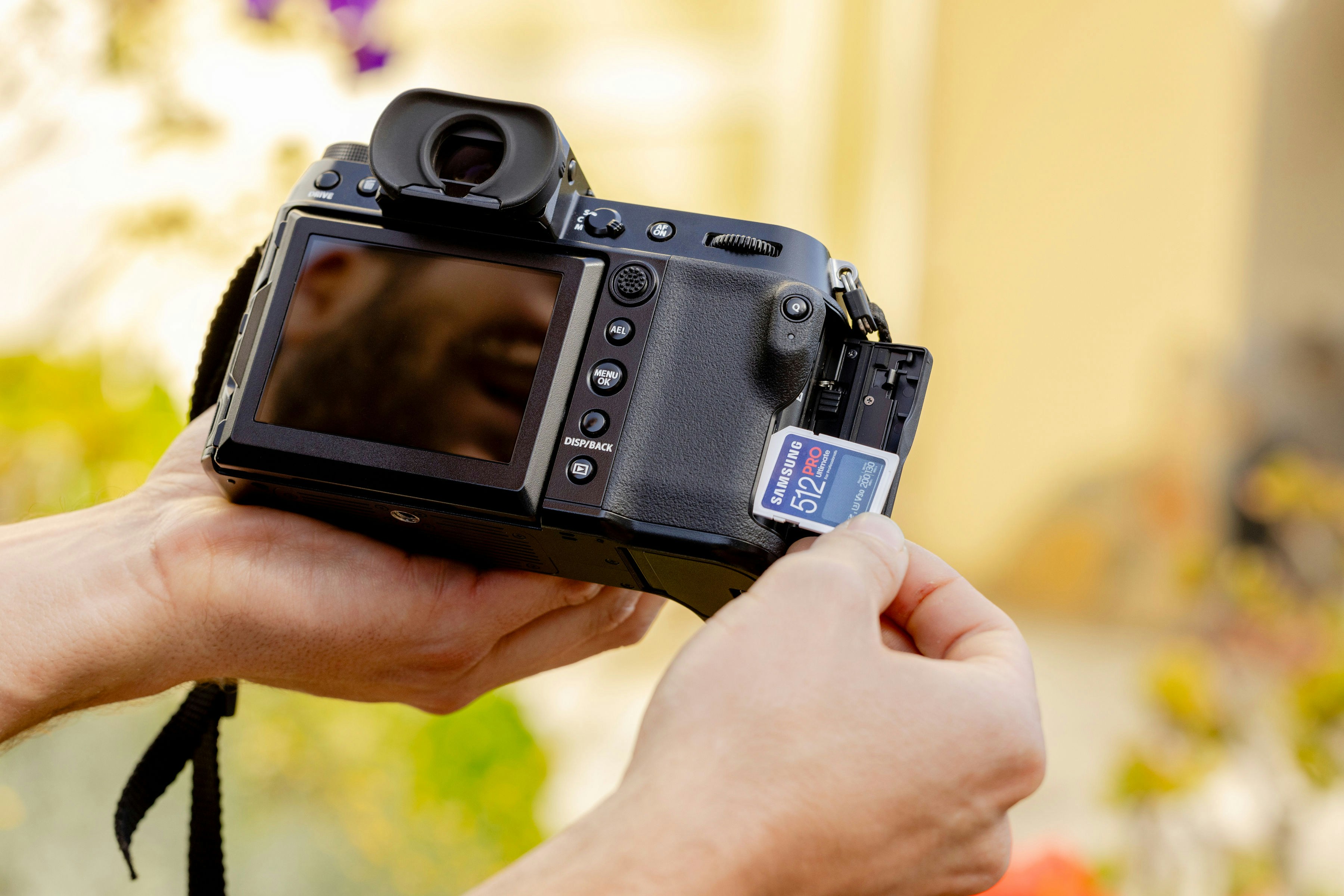 A person holding a camera up to take a picture