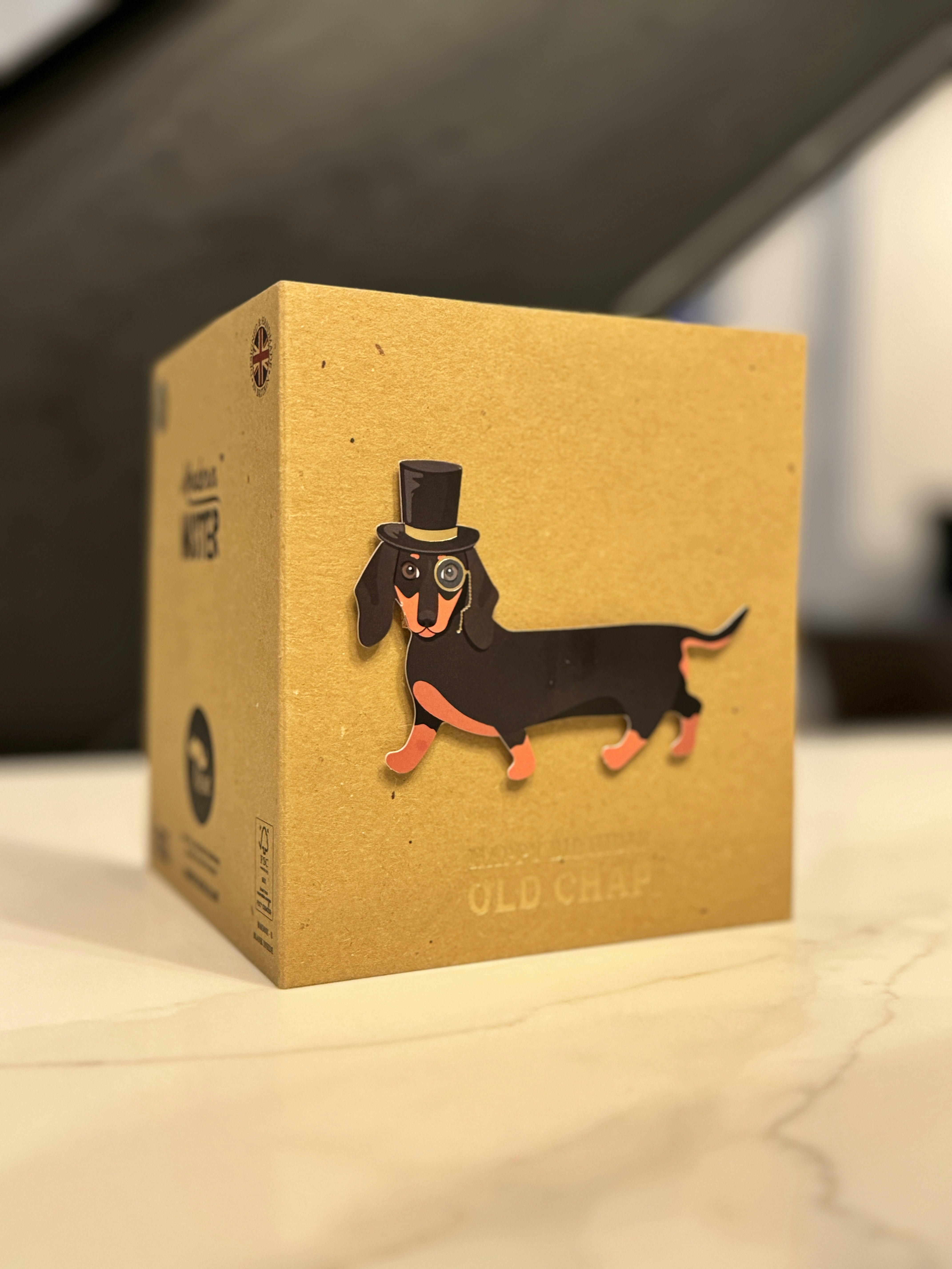 Dapper Dachshund on Kraft: A Top-Hat Mascot Gracing a Simple Box