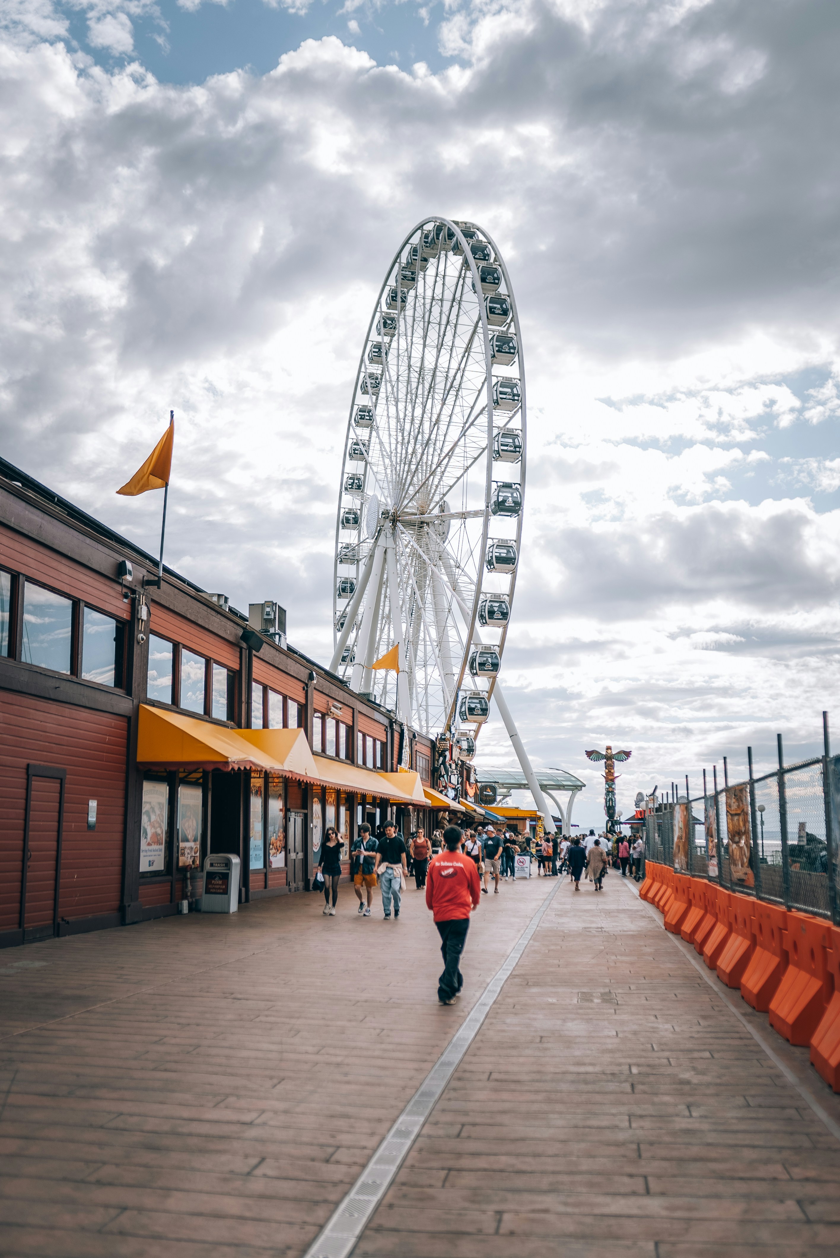A large ferris wheel sitting next to a building photo – Free Seattle ...