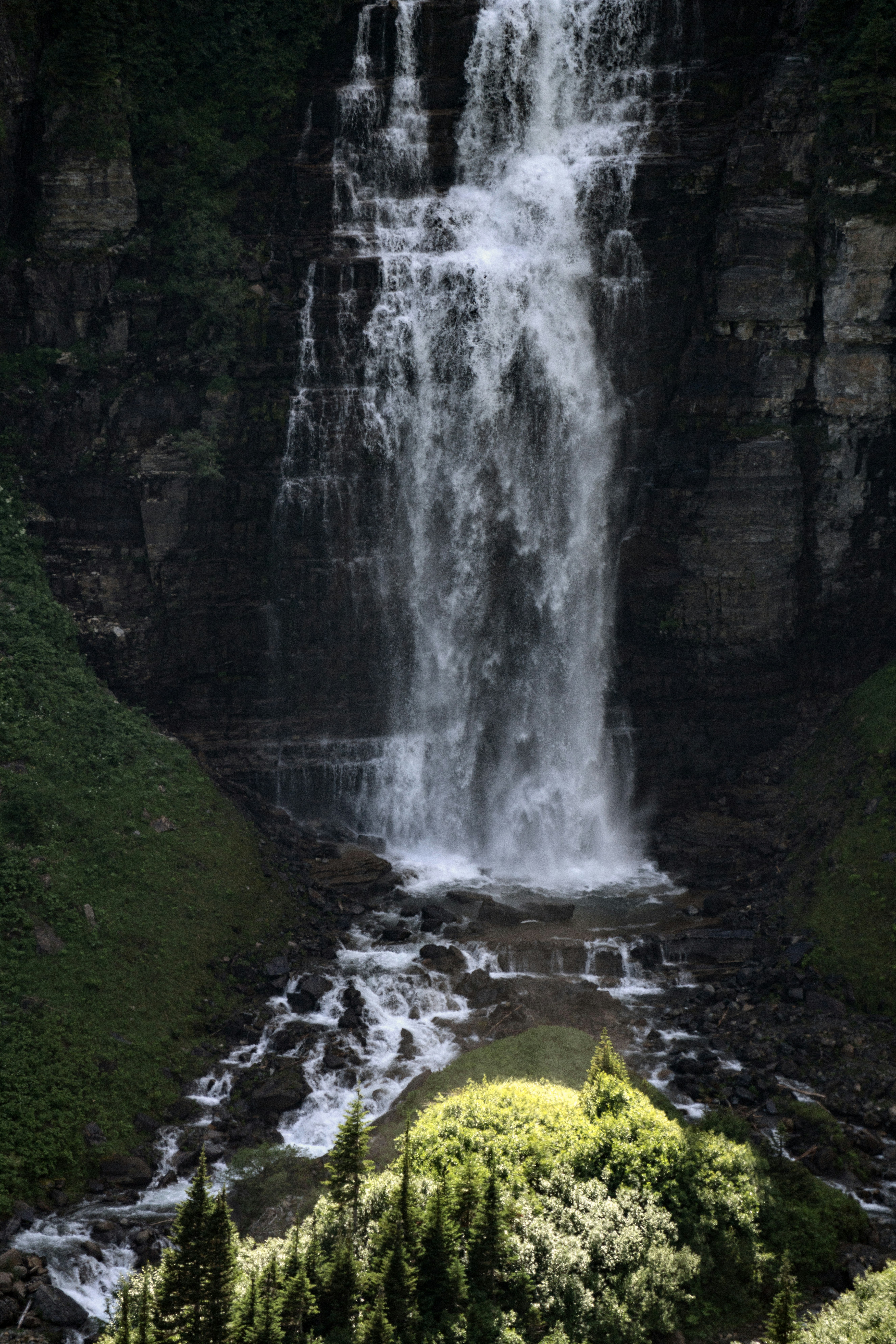Cascading Veil in a Shadowed Gorge