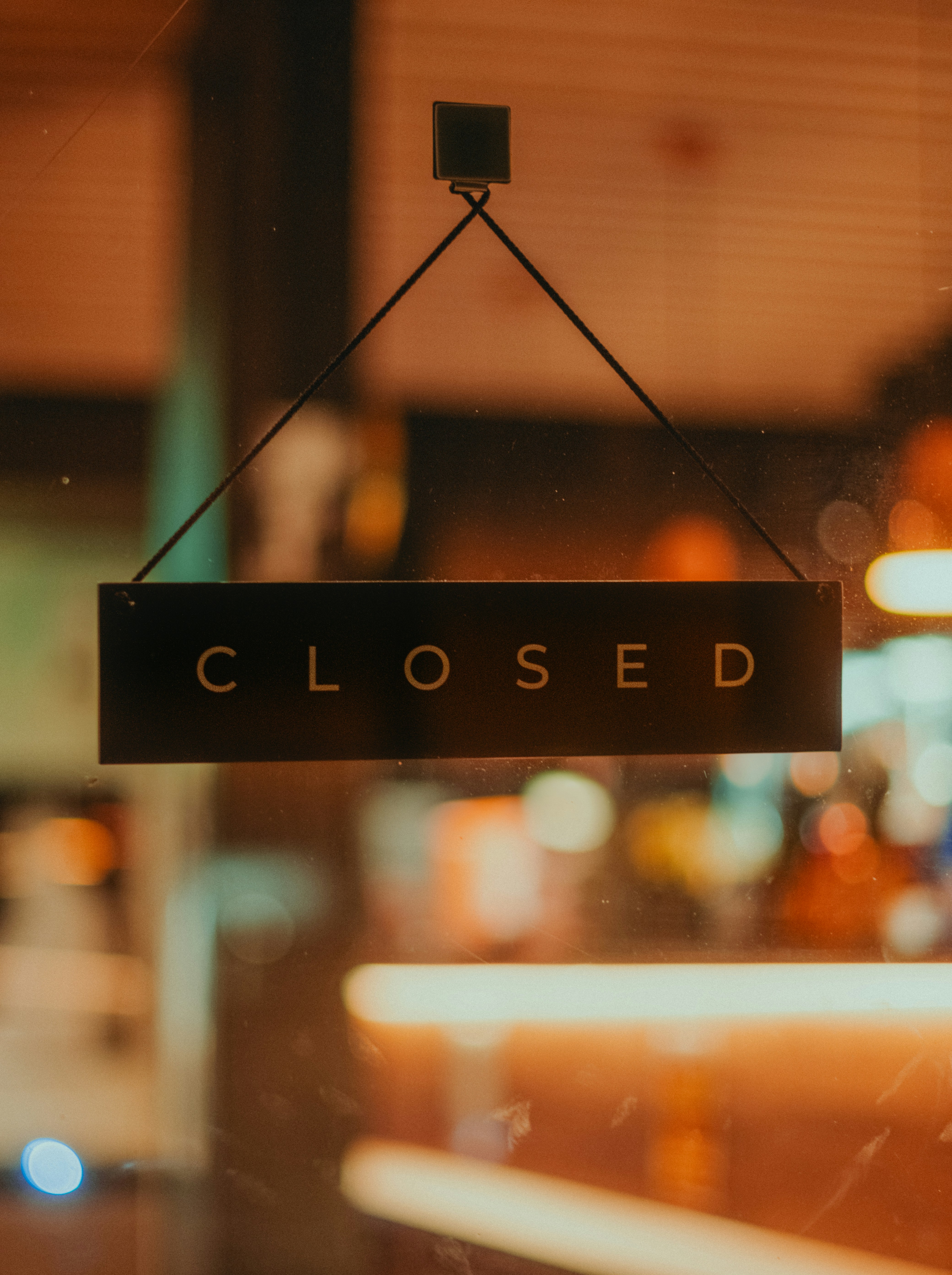 A closed sign hanging from a glass door photo – Free Interior Image on ...