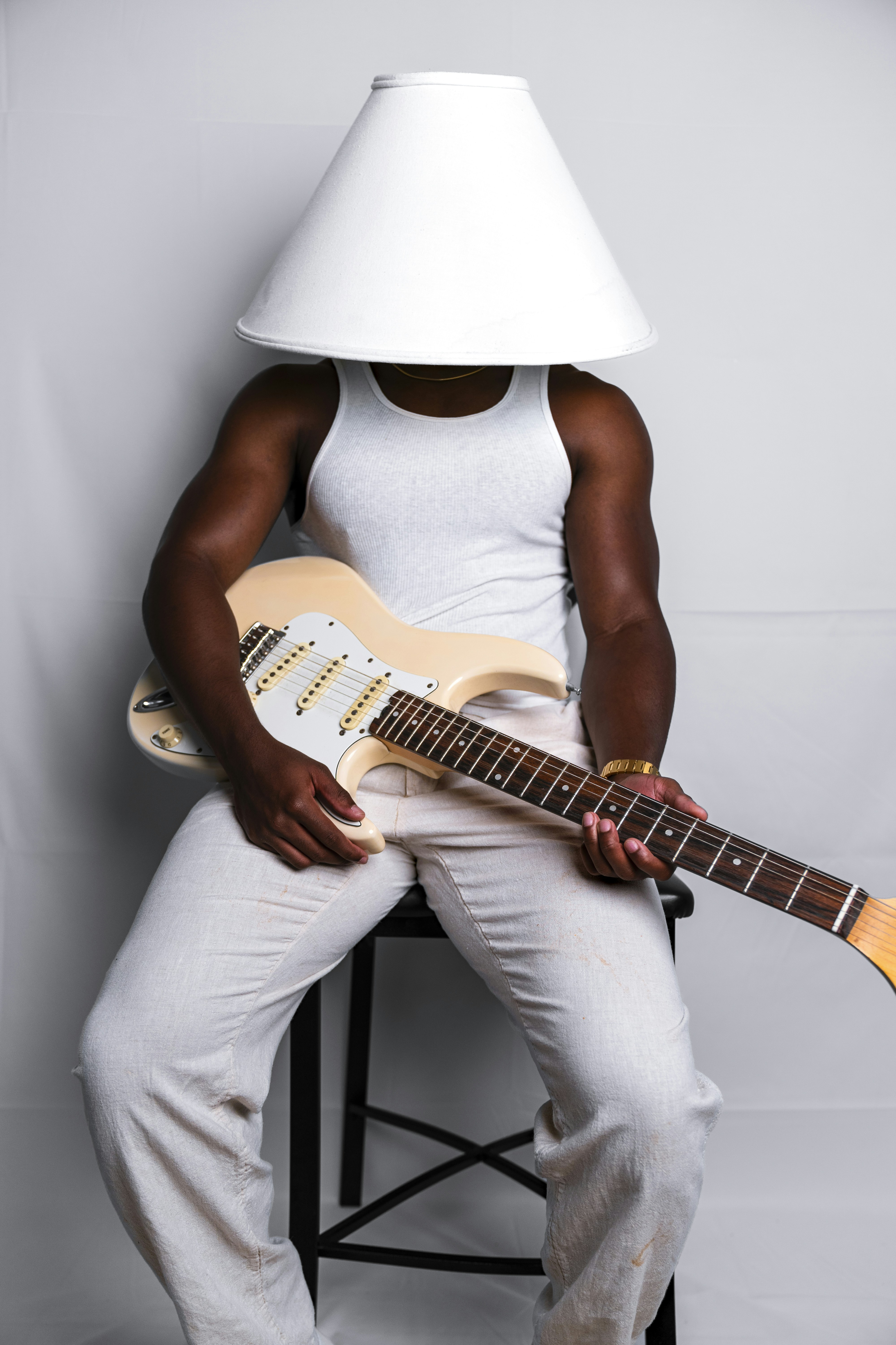 Lamphead Blues: A Studio Portrait of a Guitarist in White
