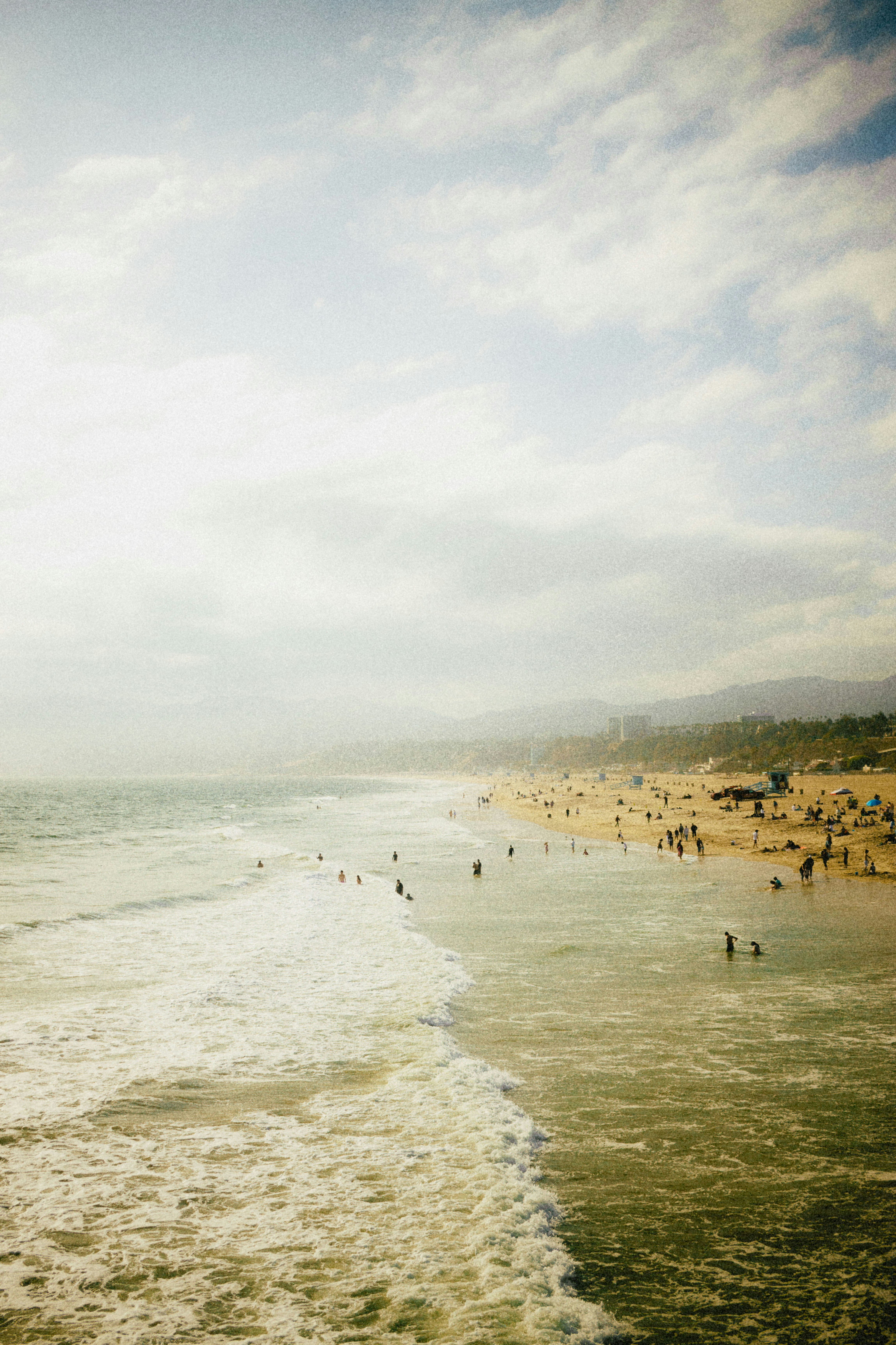 Hazy Horizon, Busy Shore: A Coastal Tapestry