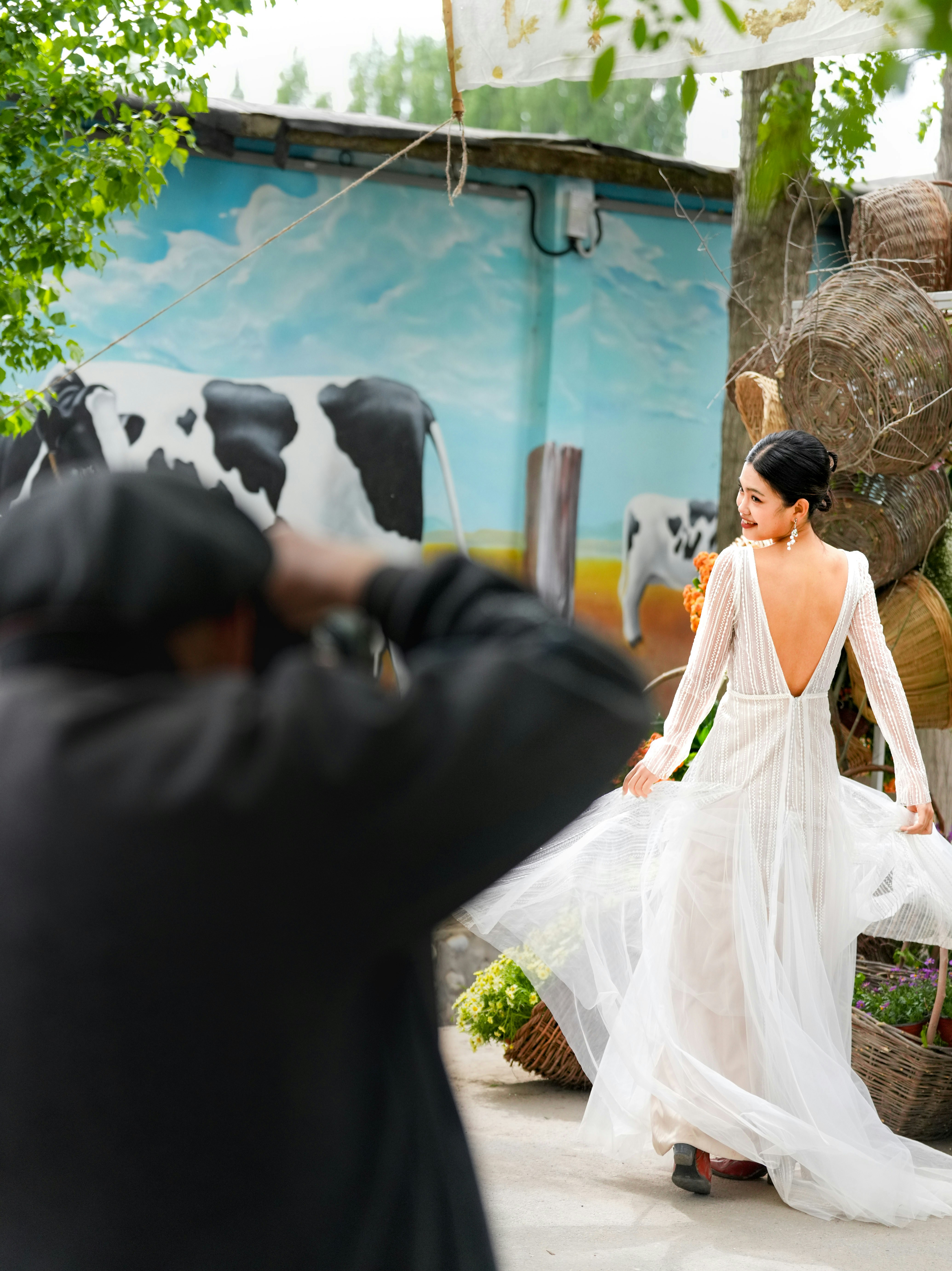 Gown in Motion Against a Farm Mural