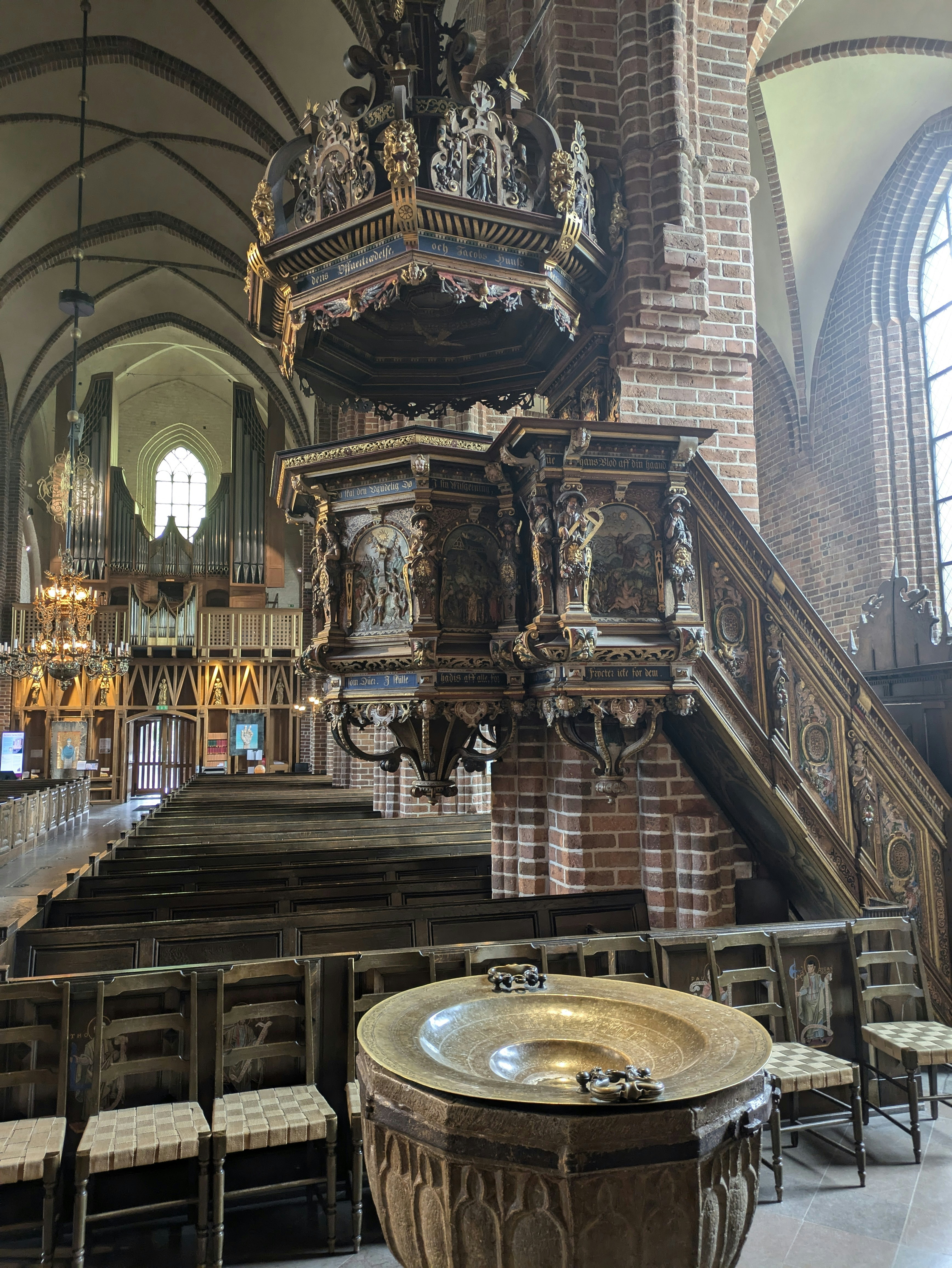 A church with a large stone alter and wooden pews photo – Free Indoors ...
