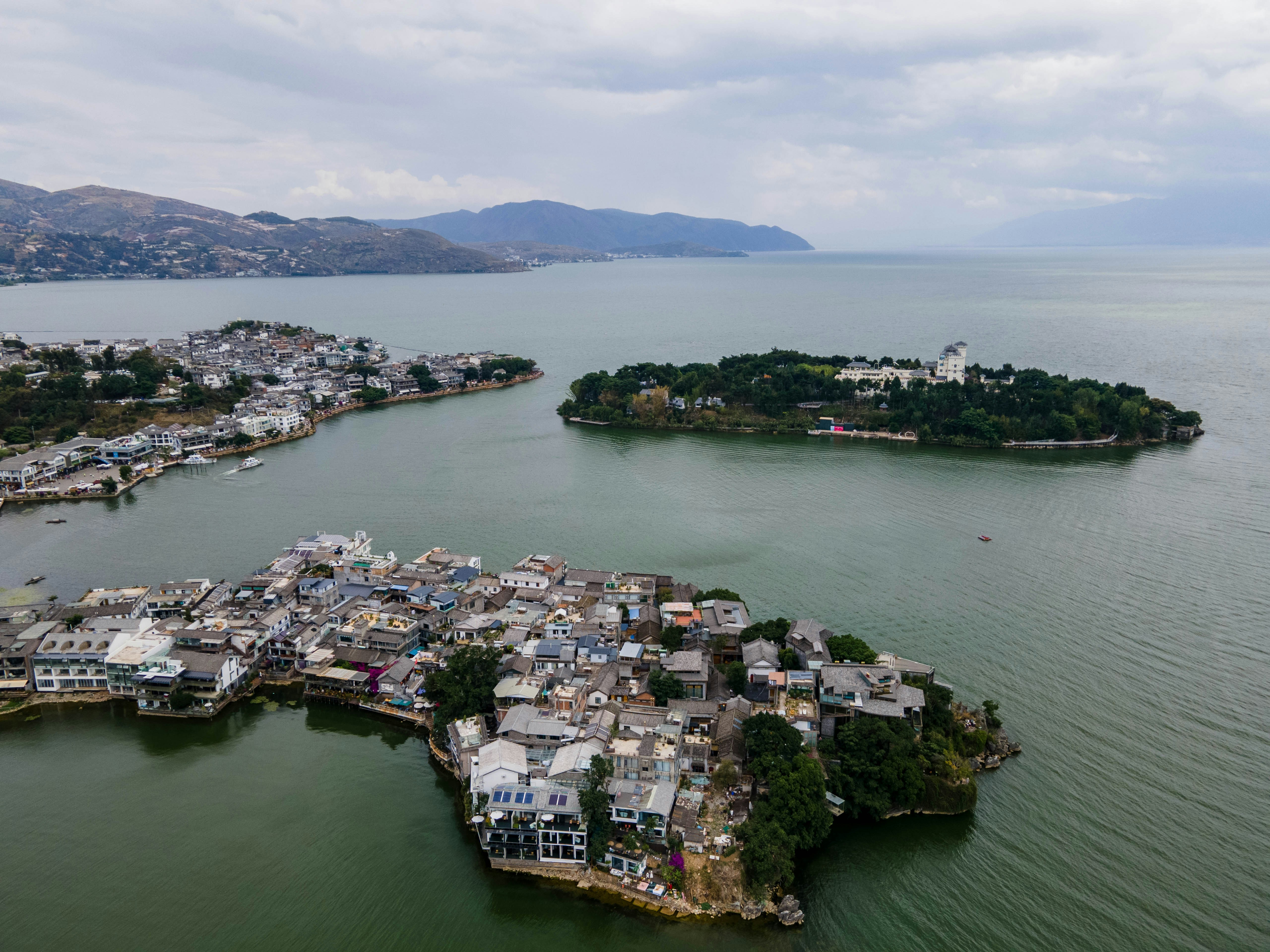An island in the middle of a body of water photo – Free Dali Image on ...