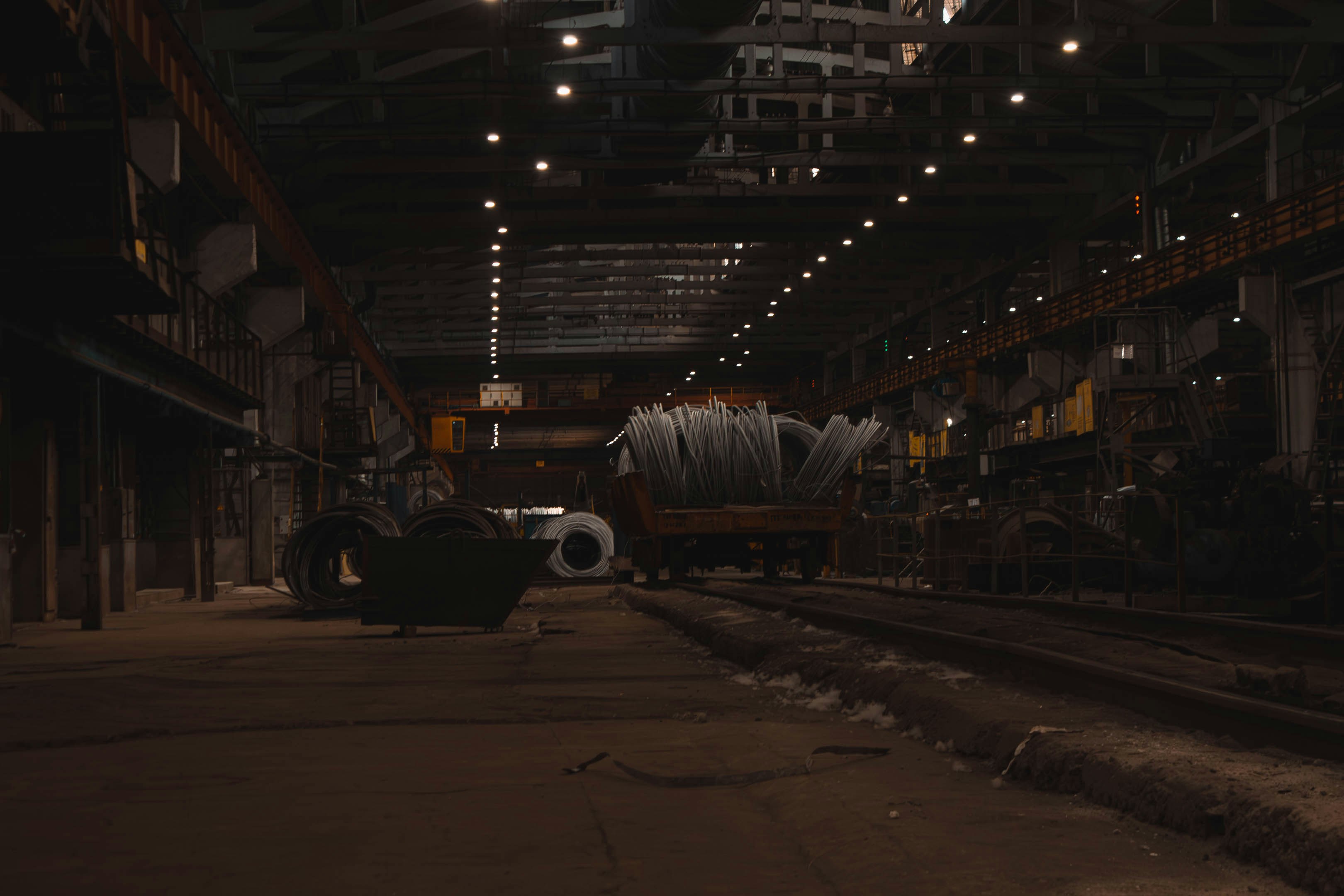 A train traveling through a train station next to a loading dock photo ...