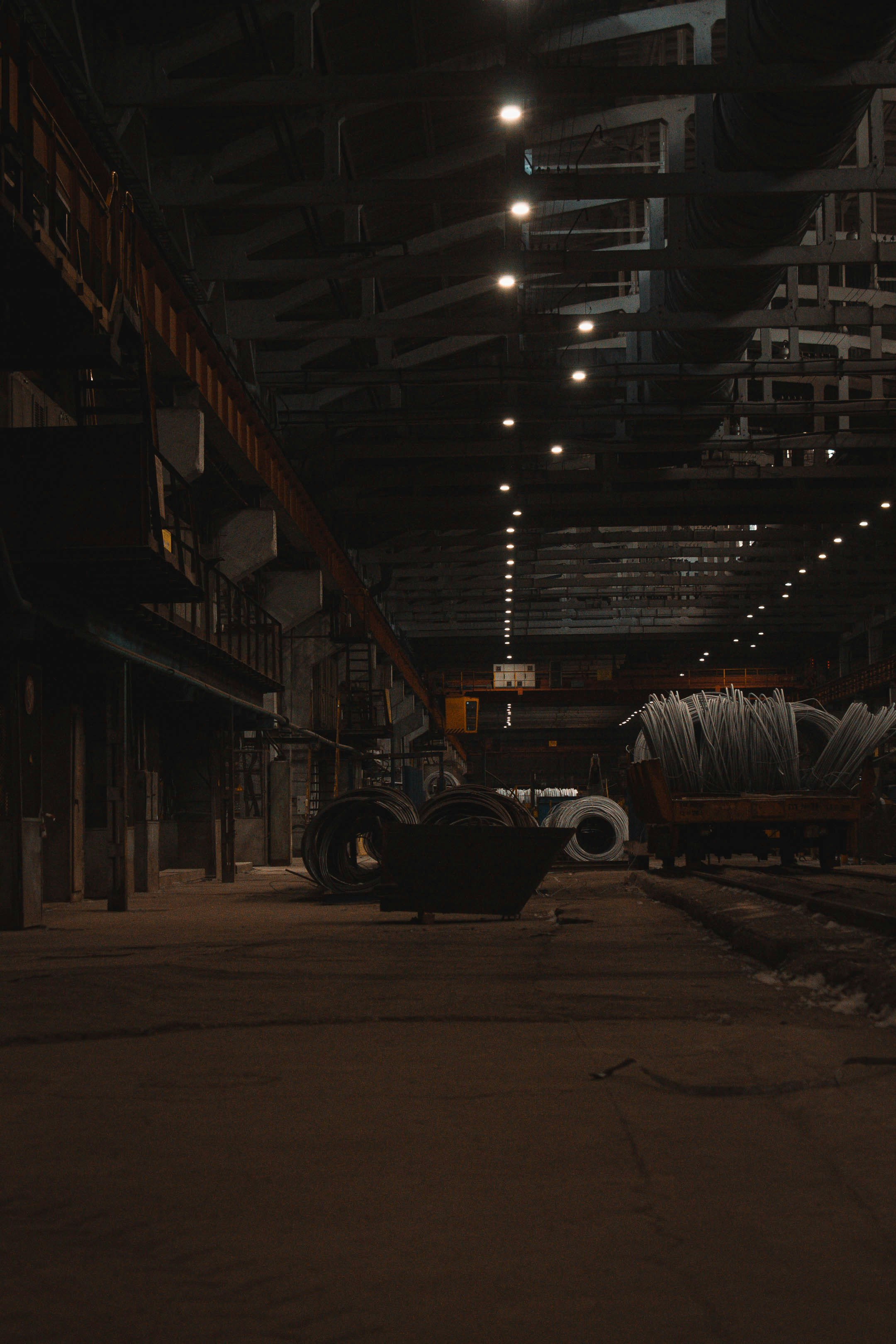 A train traveling through a train station next to a loading dock photo ...
