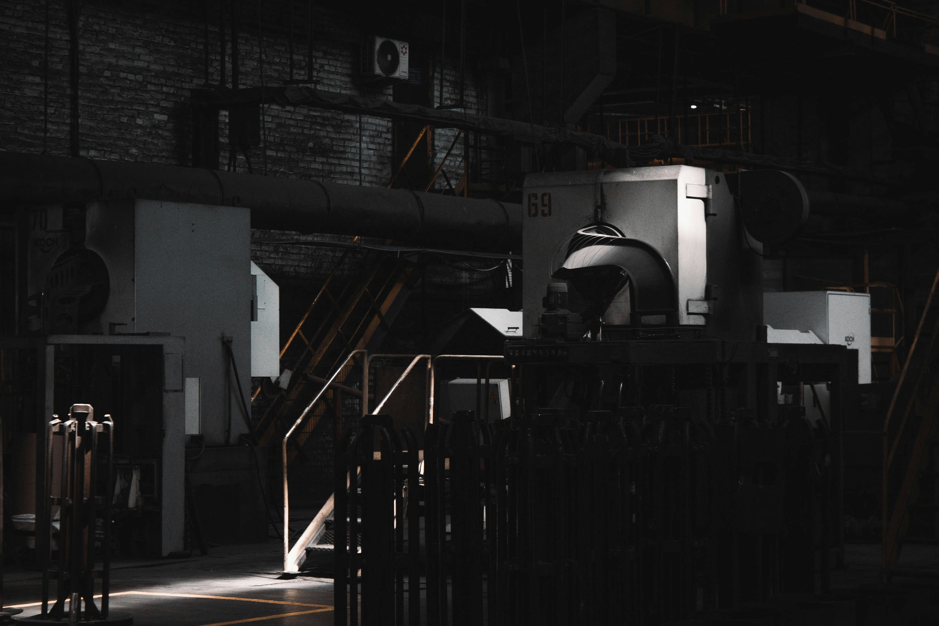 A dark room with a large machine in it photo – Free Factory Image on ...