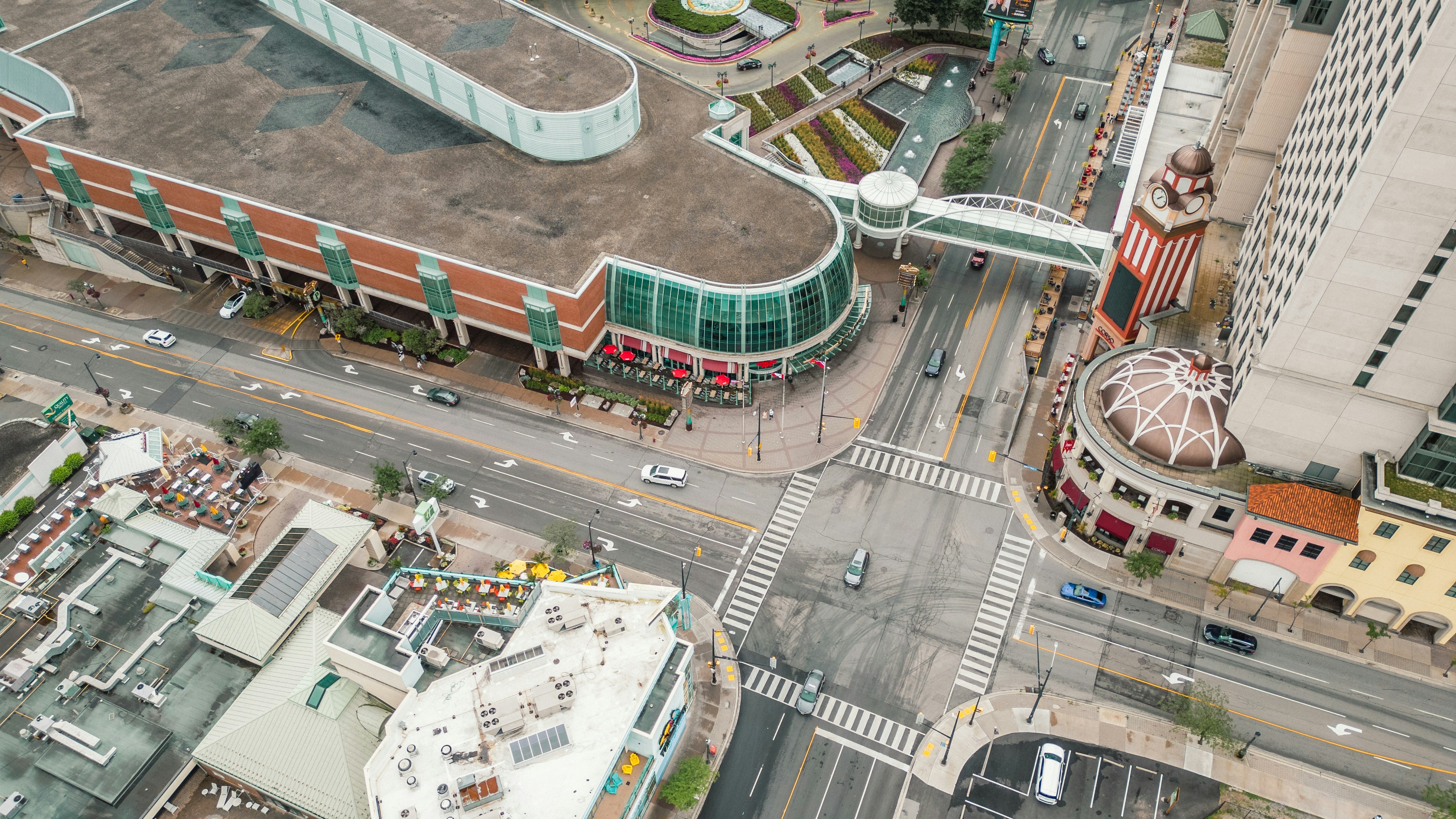 Intersection of Murray St. and Fallsview Blvd. in Niagara. Entrances to Niagara Casino, Hilton and Holiday Inn Hotels. | An aerial view of a city with a lot of buildings