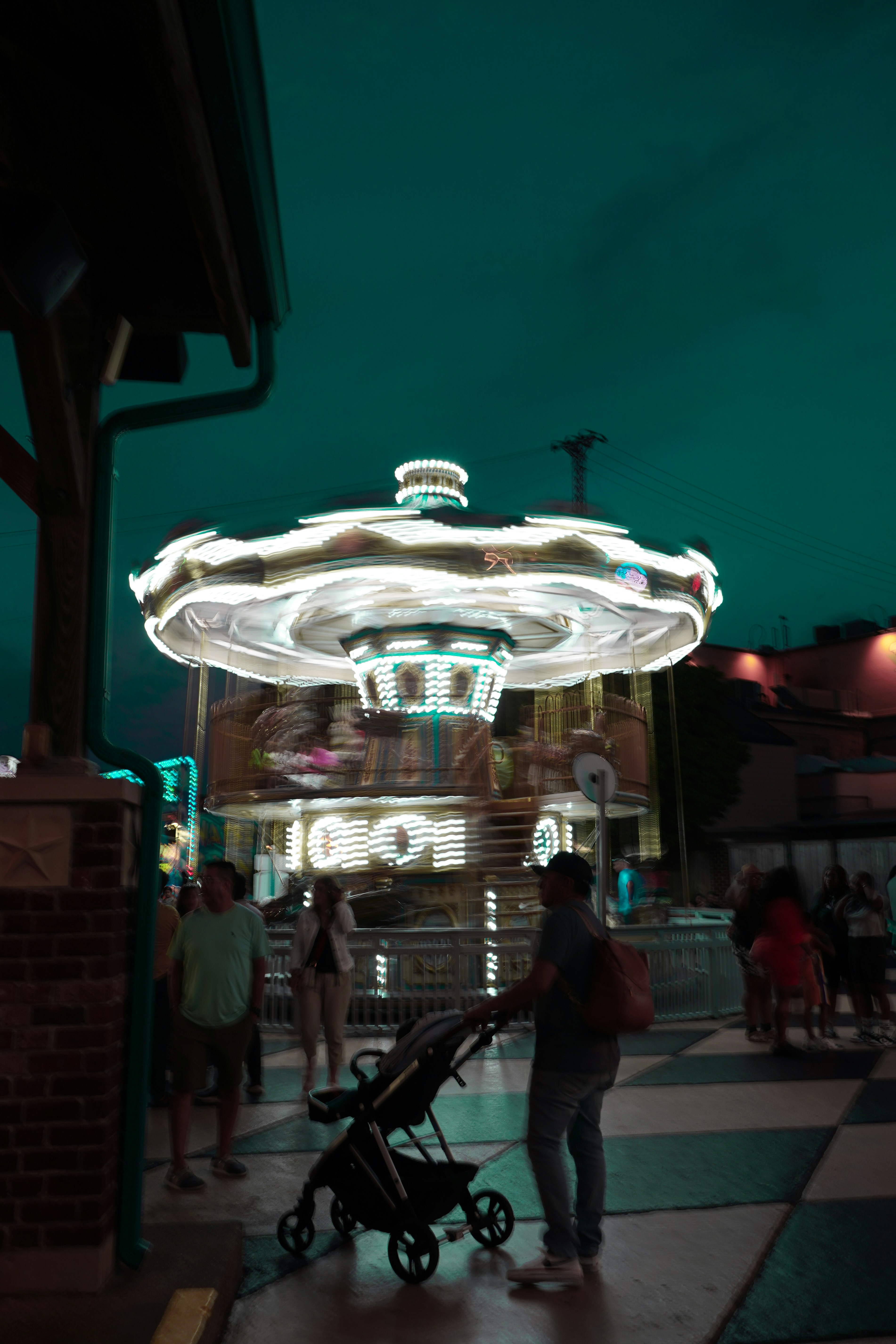 Neon Carousel in Turquoise Night: Motion and Light