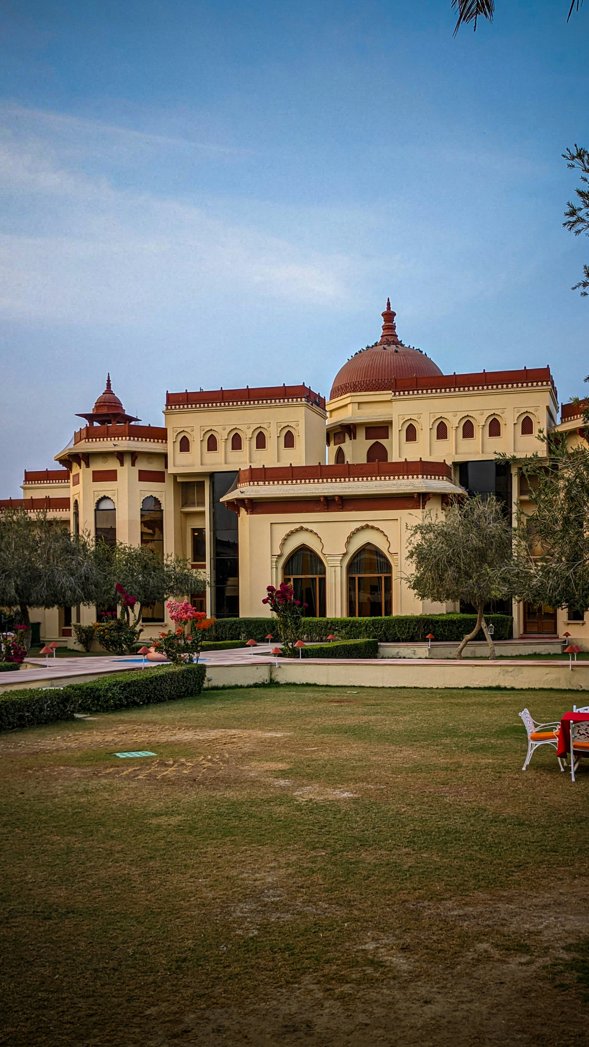 A large building with a lawn in front of it