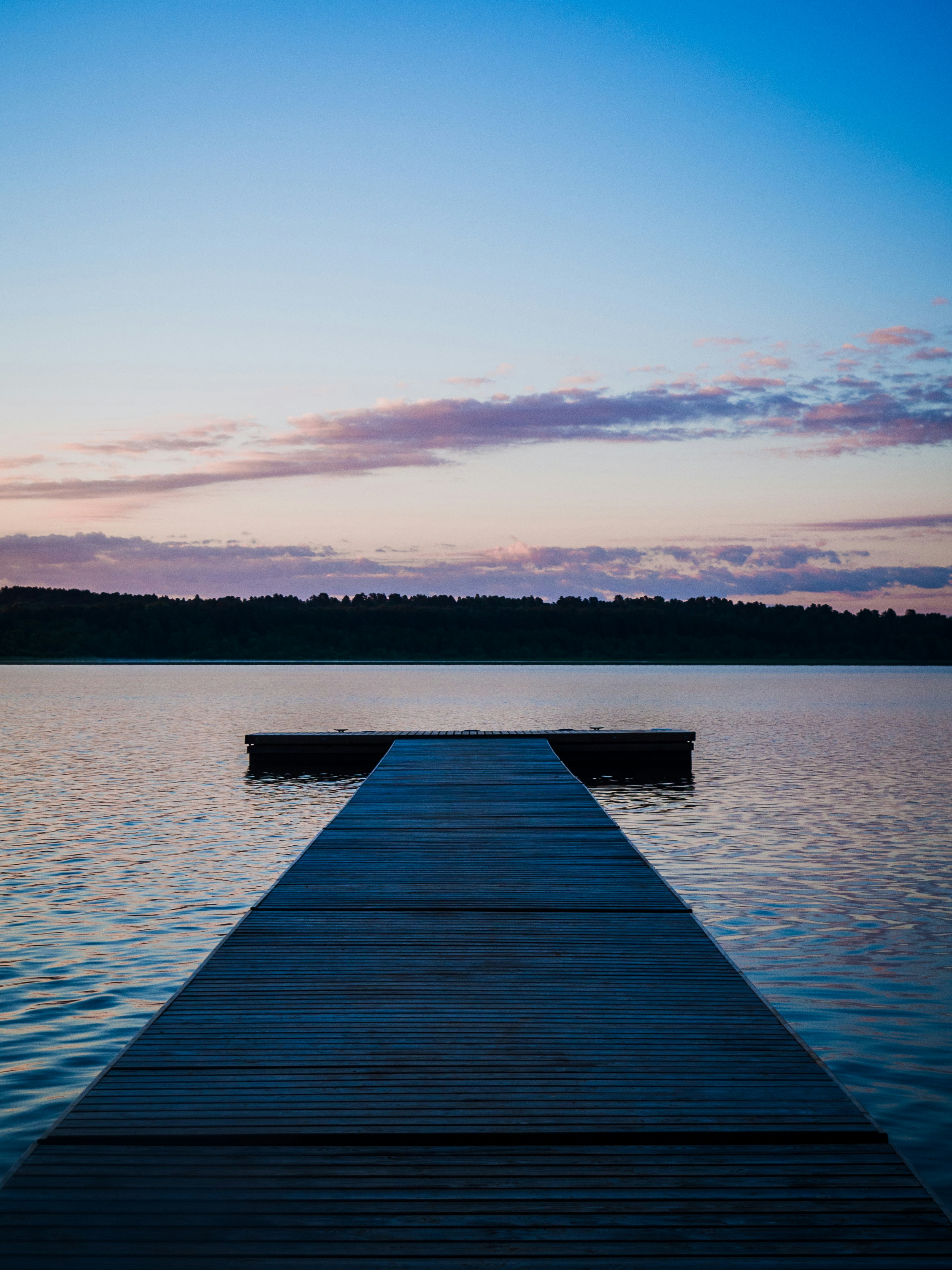 A long dock extending into a body of water photo – Free Dock Image on ...