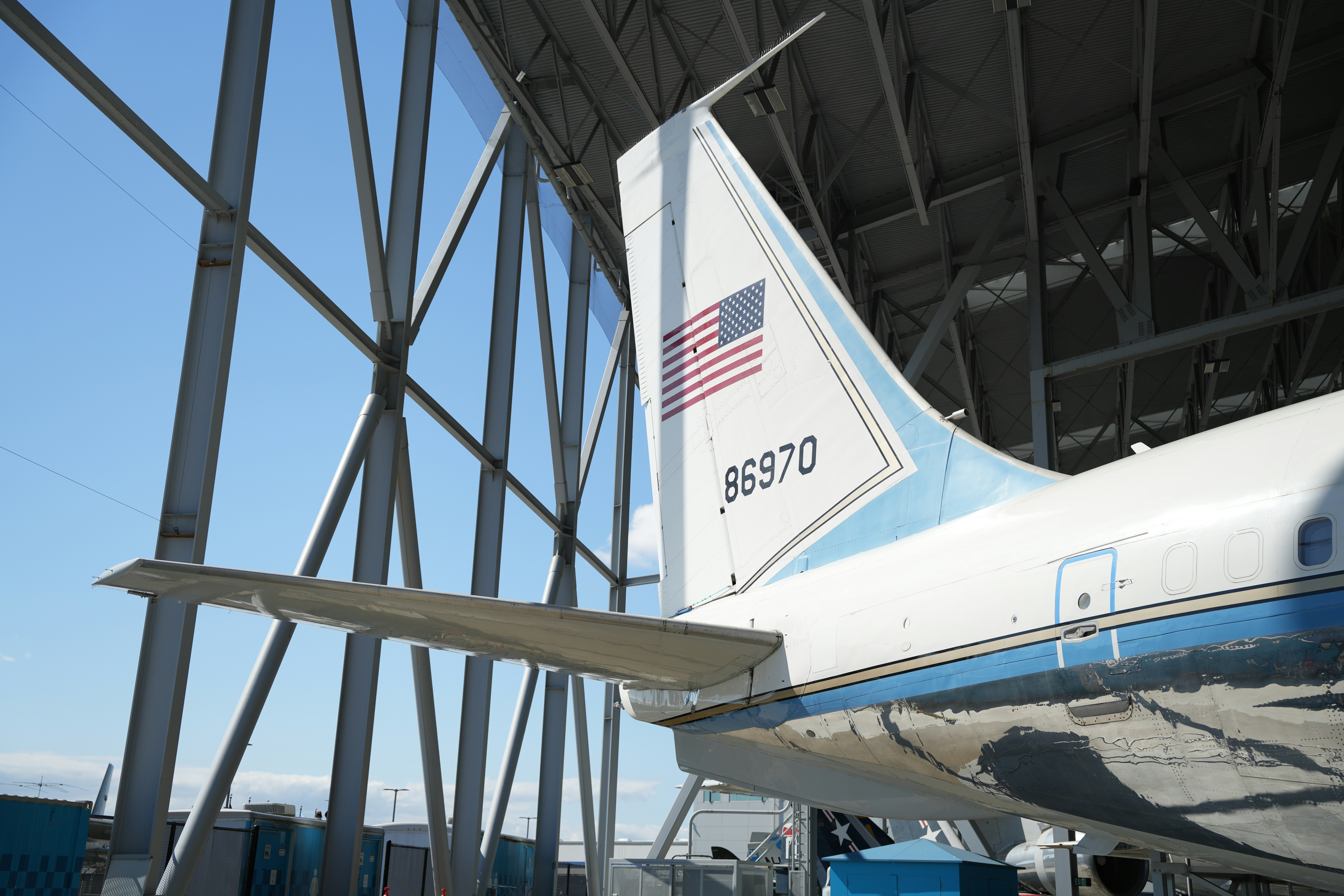 An airplane is parked in a hanger at an airport photo – Free The museum ...