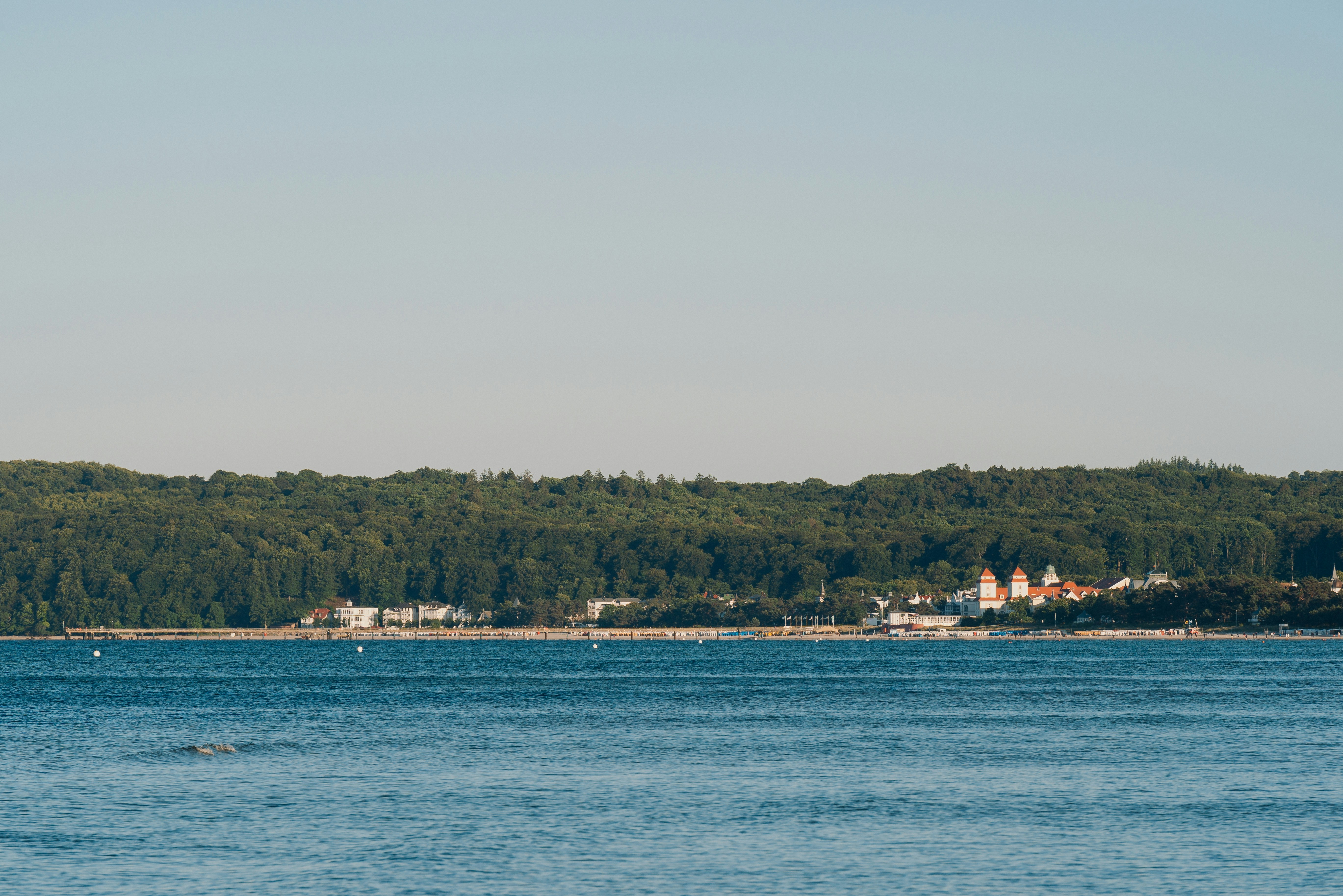 A boat floating on top of a large body of water photo – Free Binz Image ...