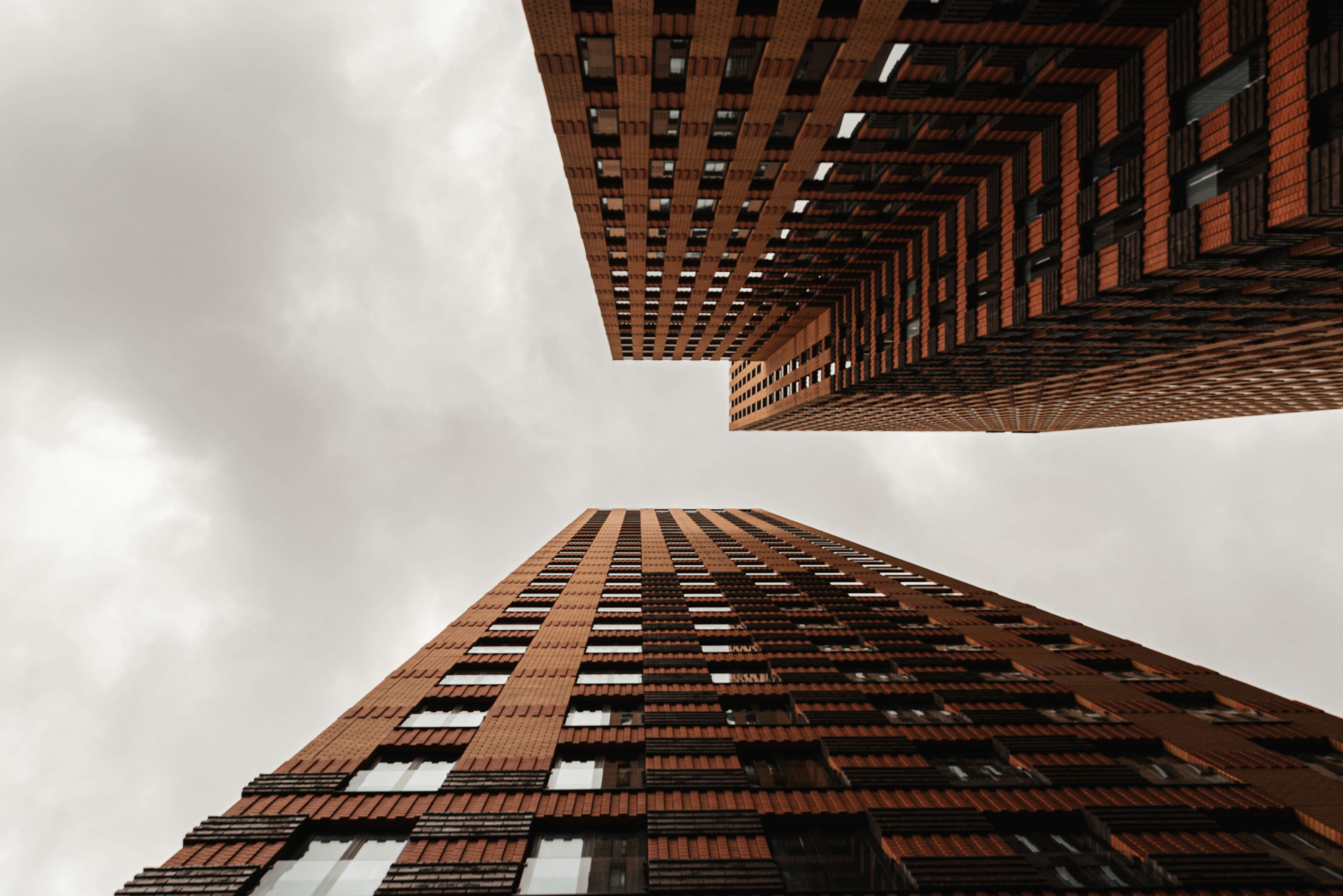 Looking up at a tall building from the ground photo – Free Urban Image ...