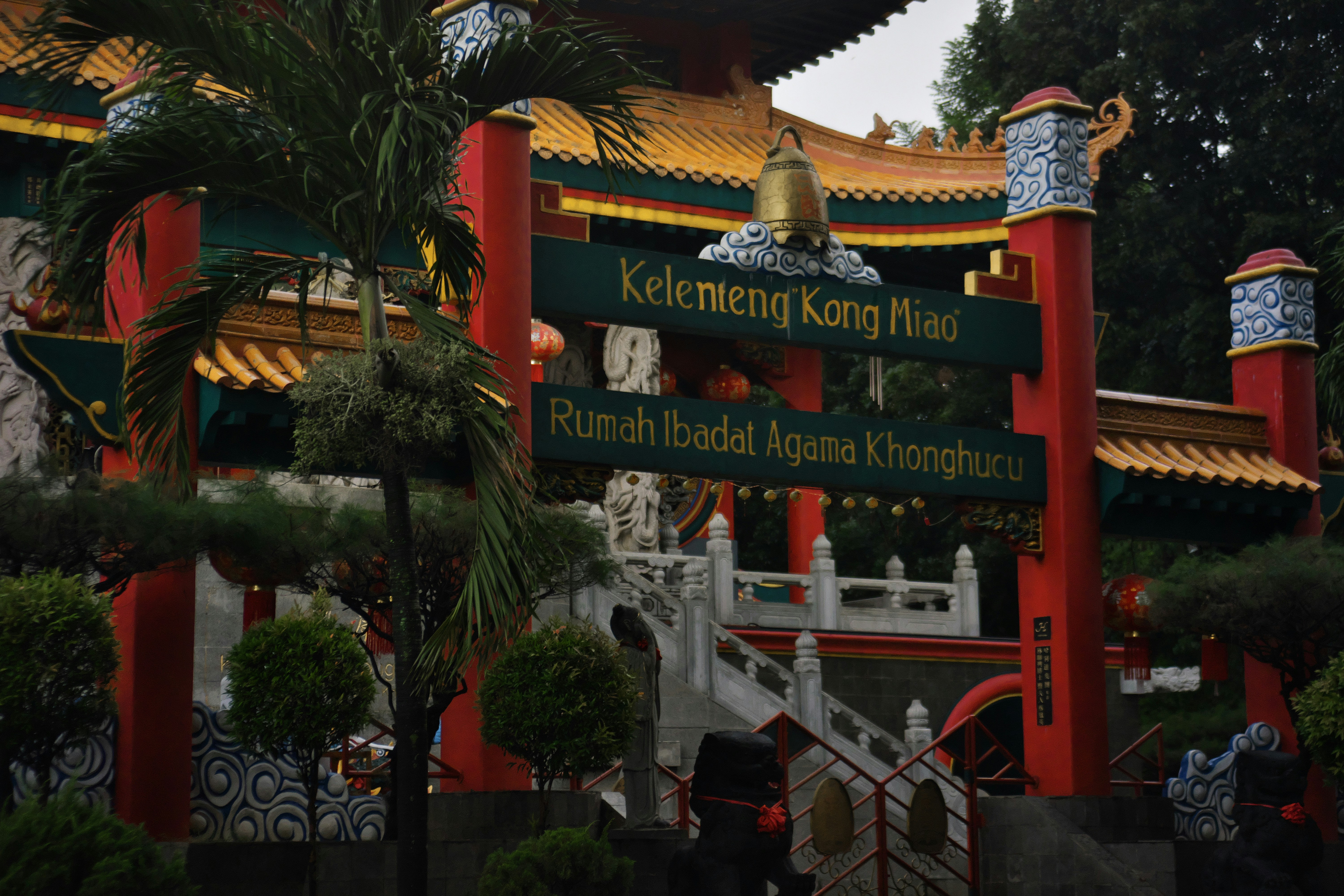 Gate of Red Pillars: Green Plaques Framing a Khonghucu Temple Entrance