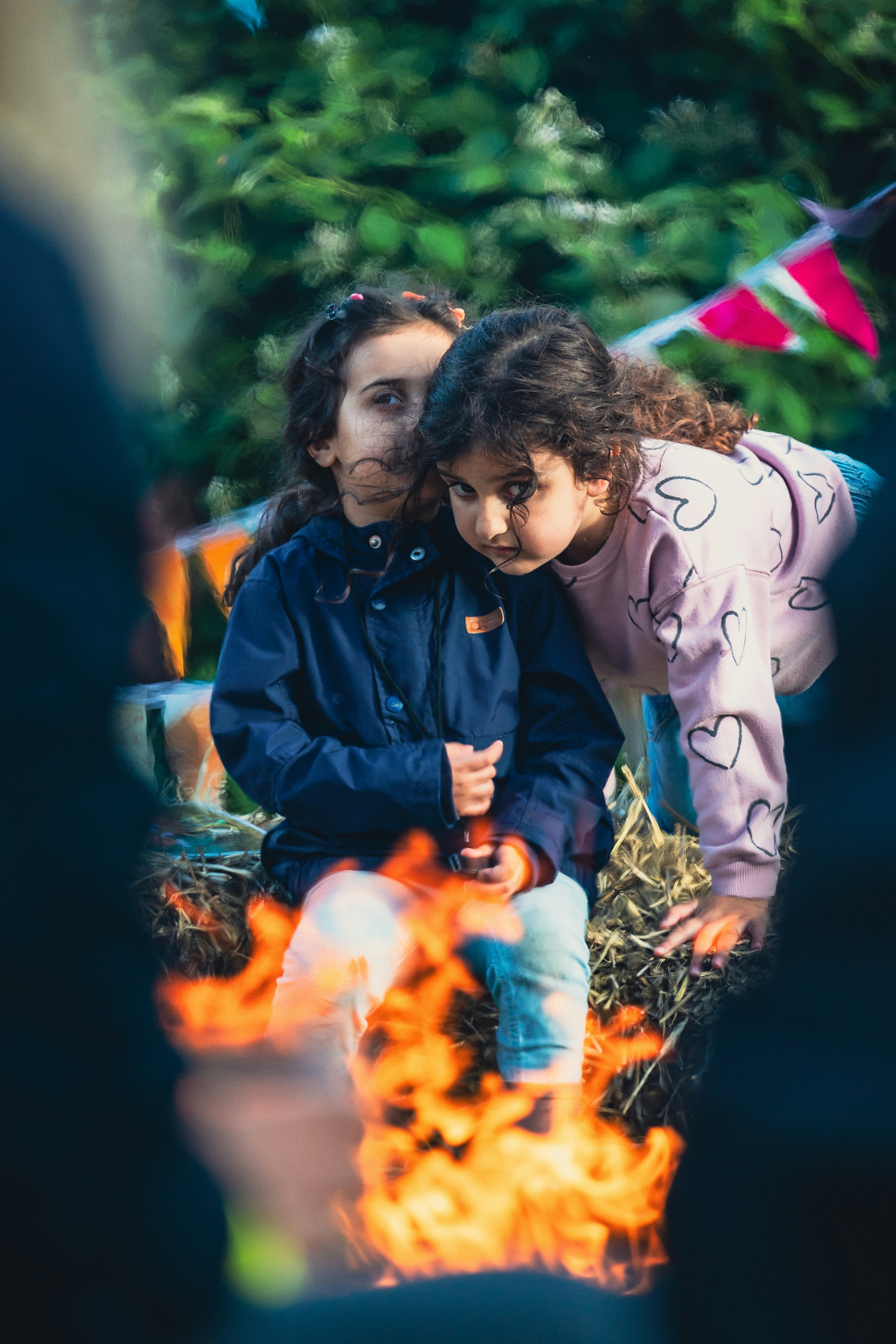 Flame and Friendship: A Close Moment by the Campfire