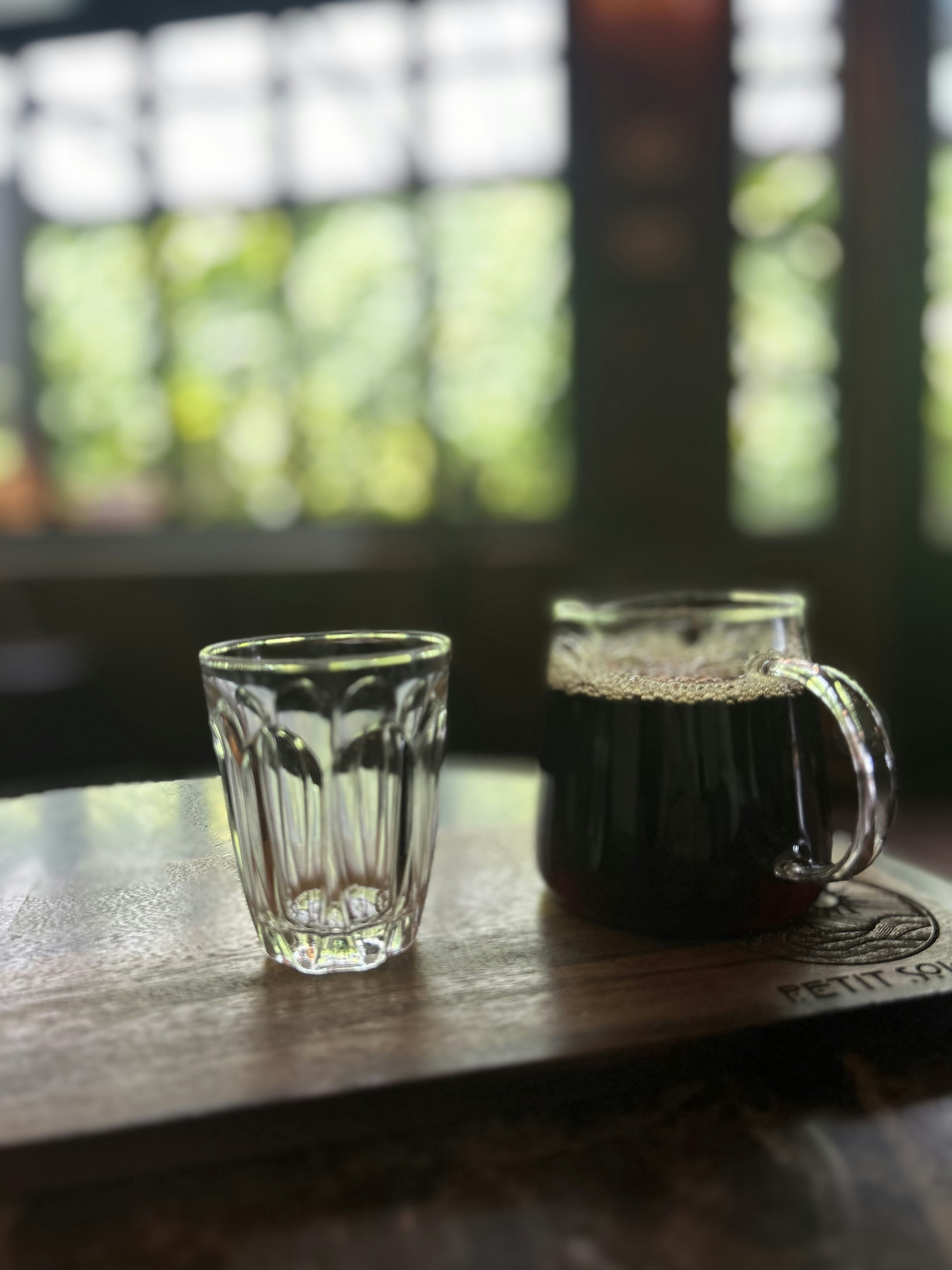 A coffee mug and a glass in Bangkok, Thailand.