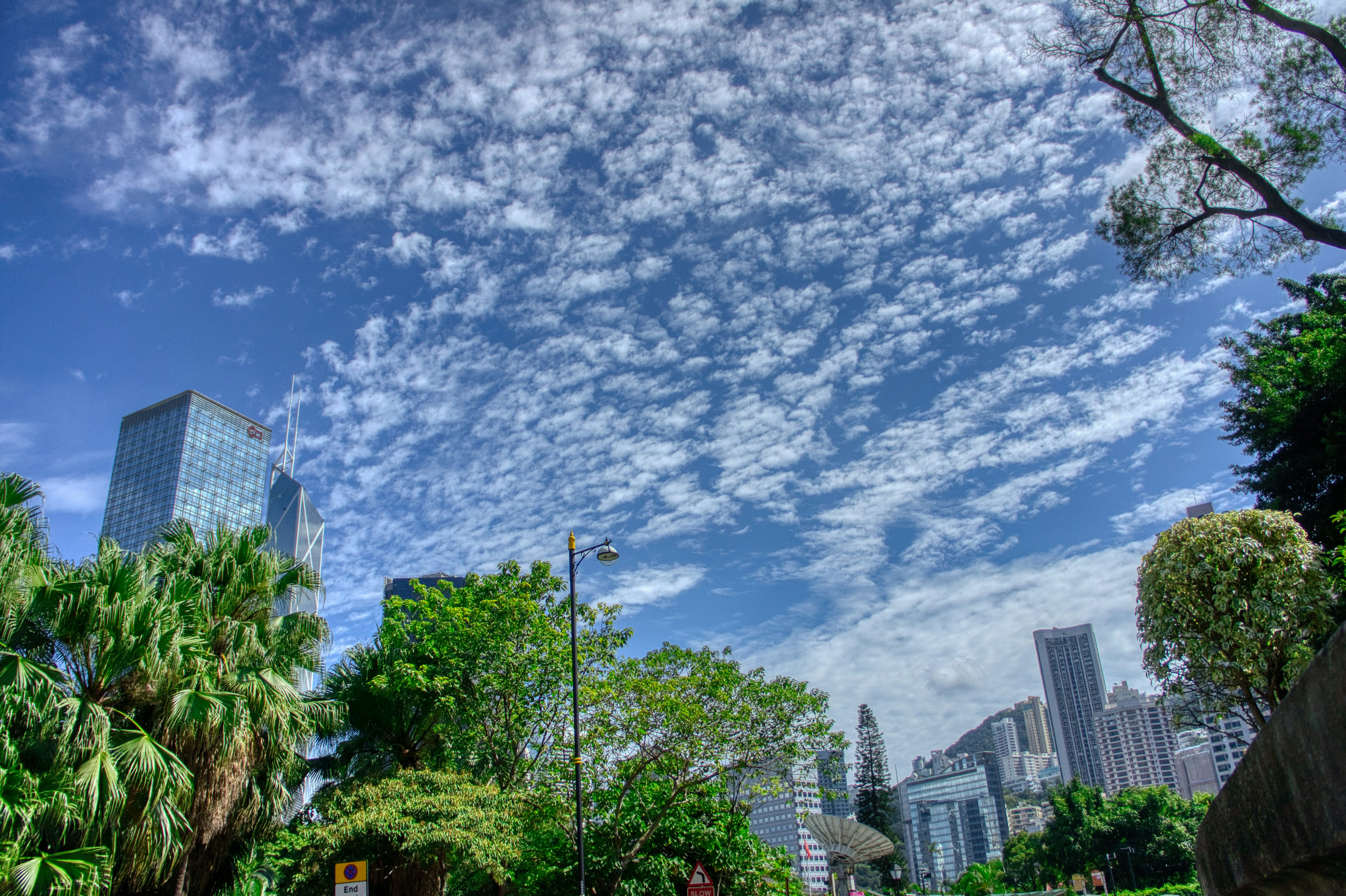 Central Lamppost Anchors a Patchwork Sky Over the City
