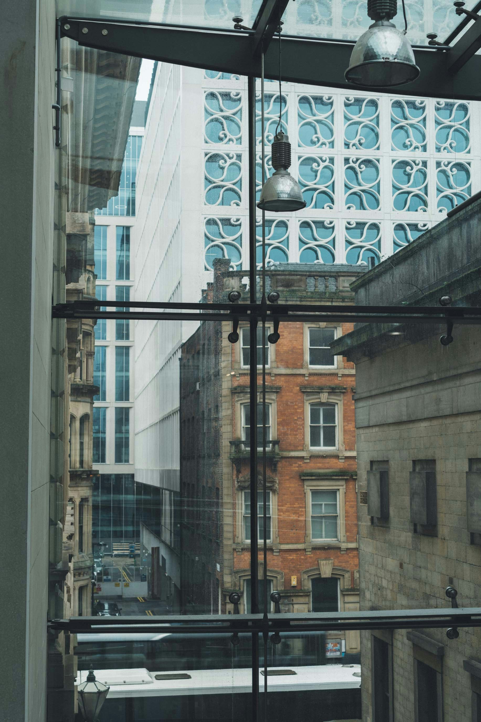 A view of a city through a glass window photo – Free City Image on Unsplash