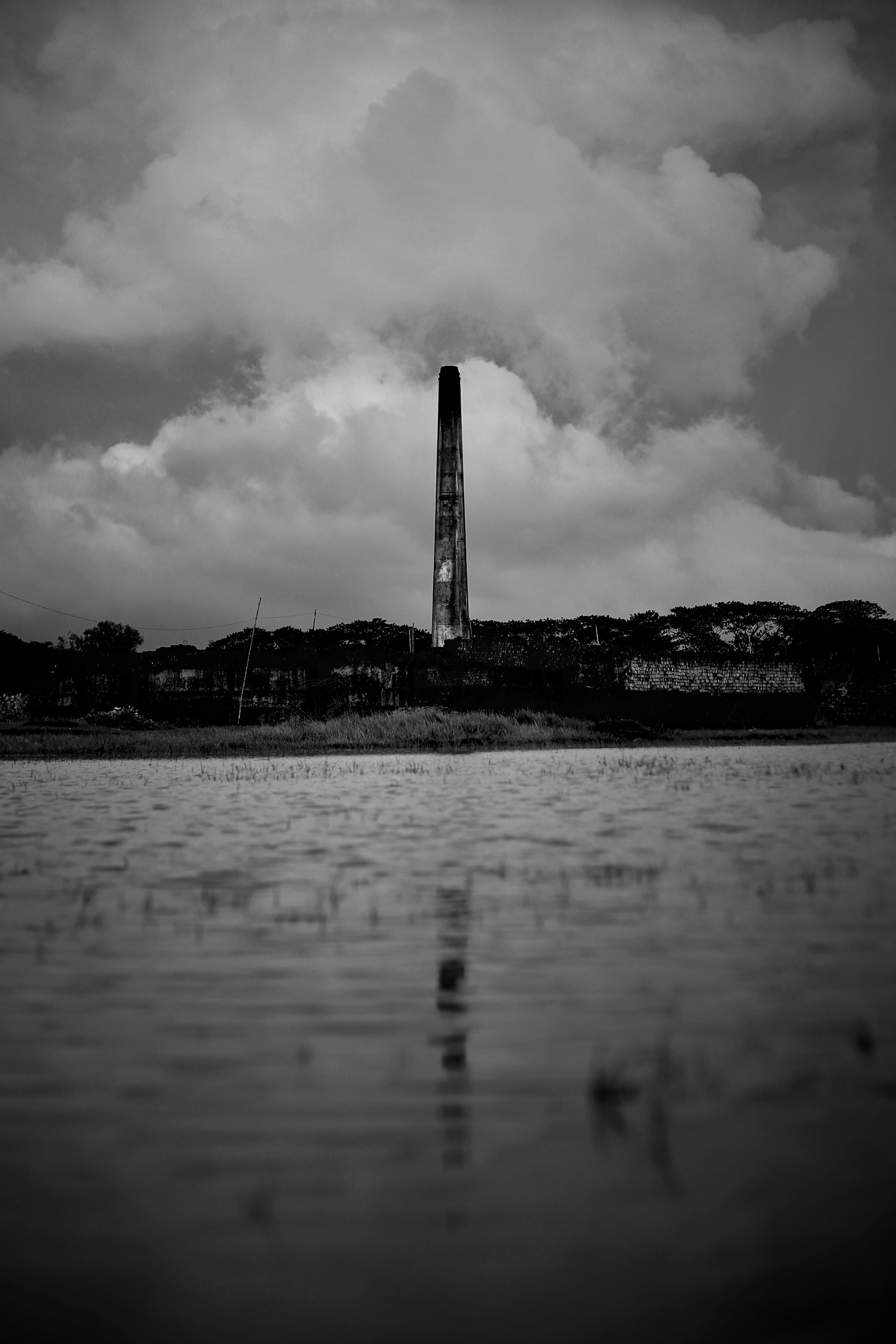 Sentinel Chimney Over a Quiet Shore