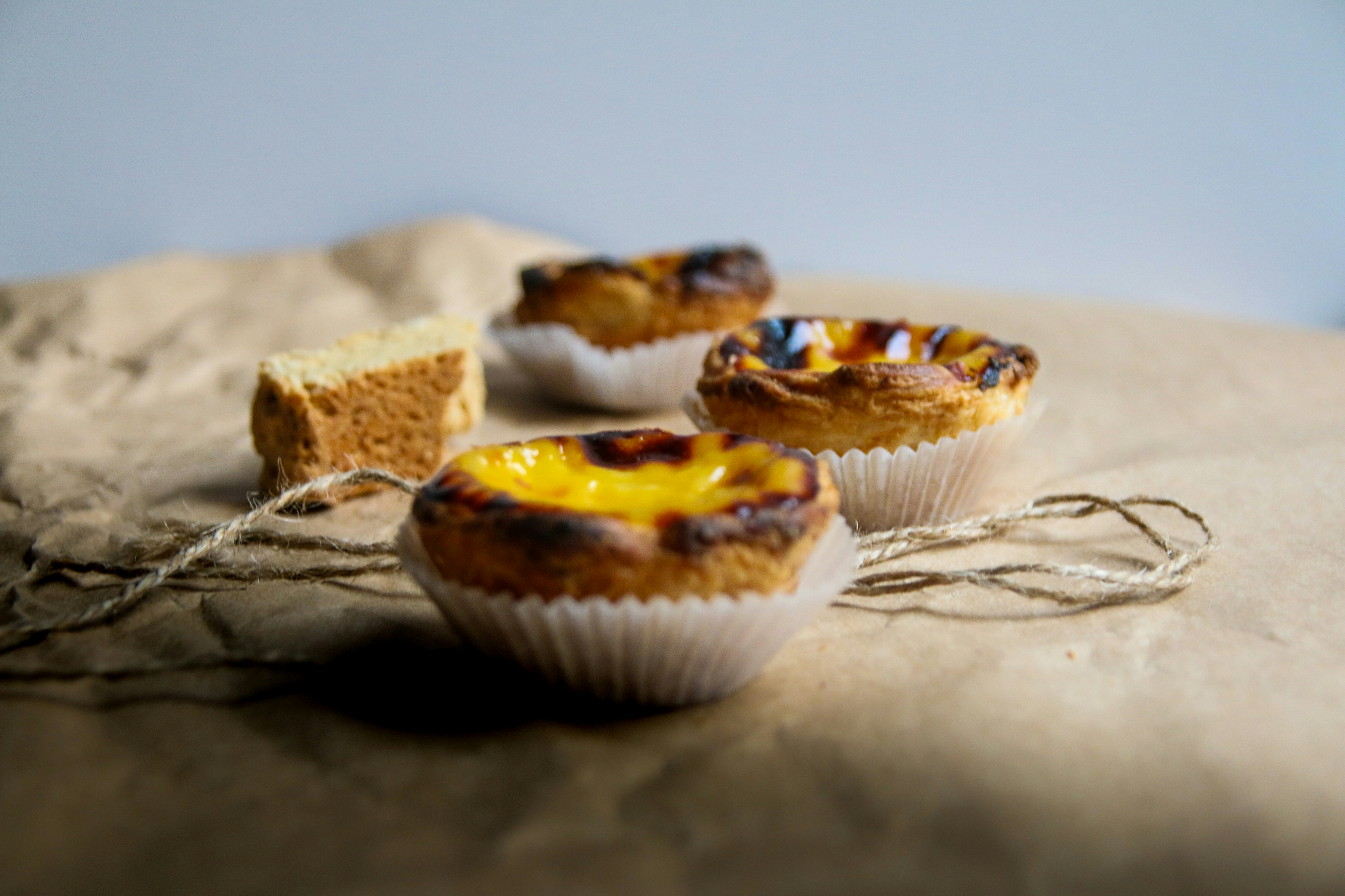 Golden Pastry Trio on Rustic Canvas