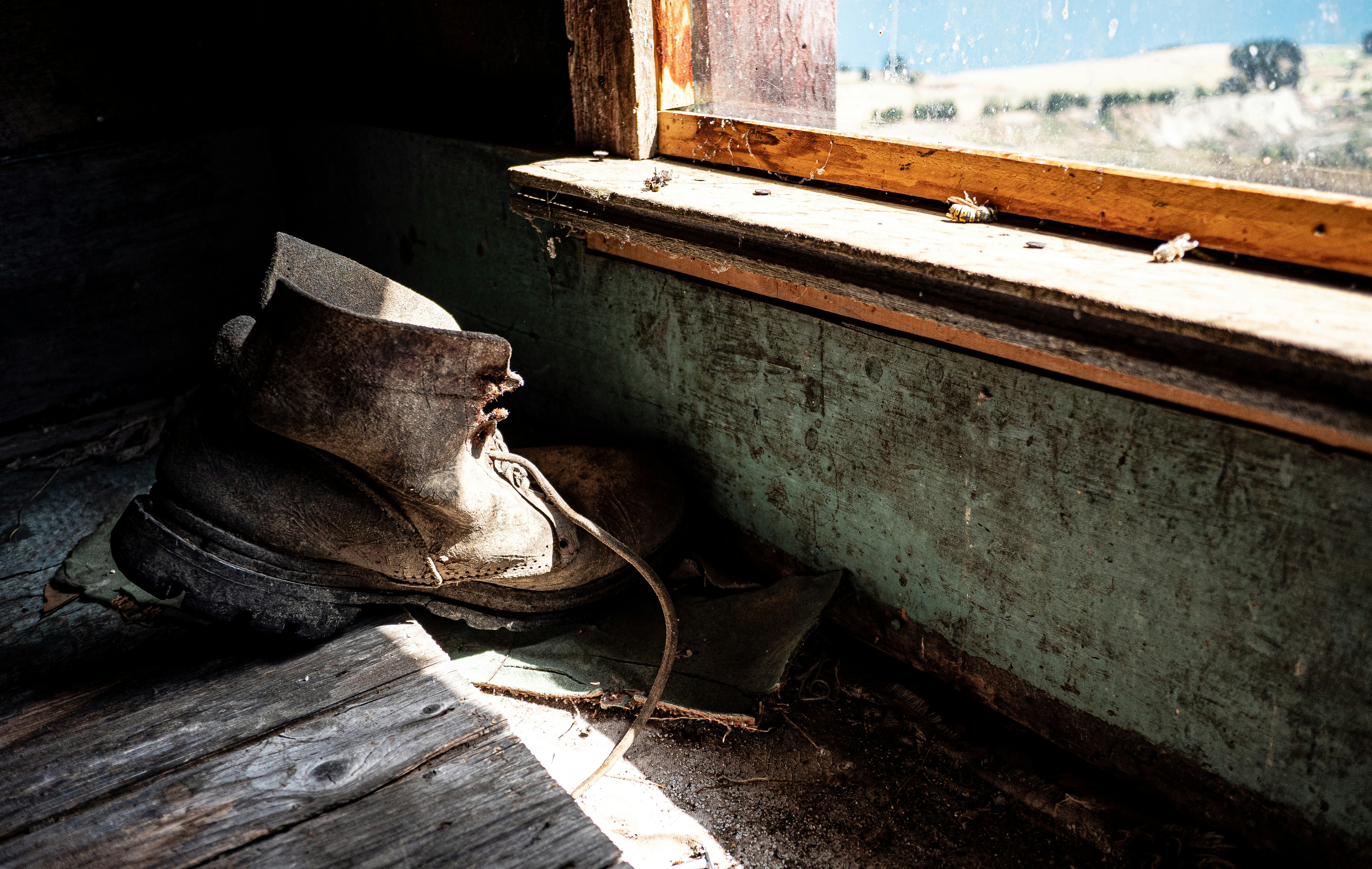 Dusty Workboot by the Sunlit Window