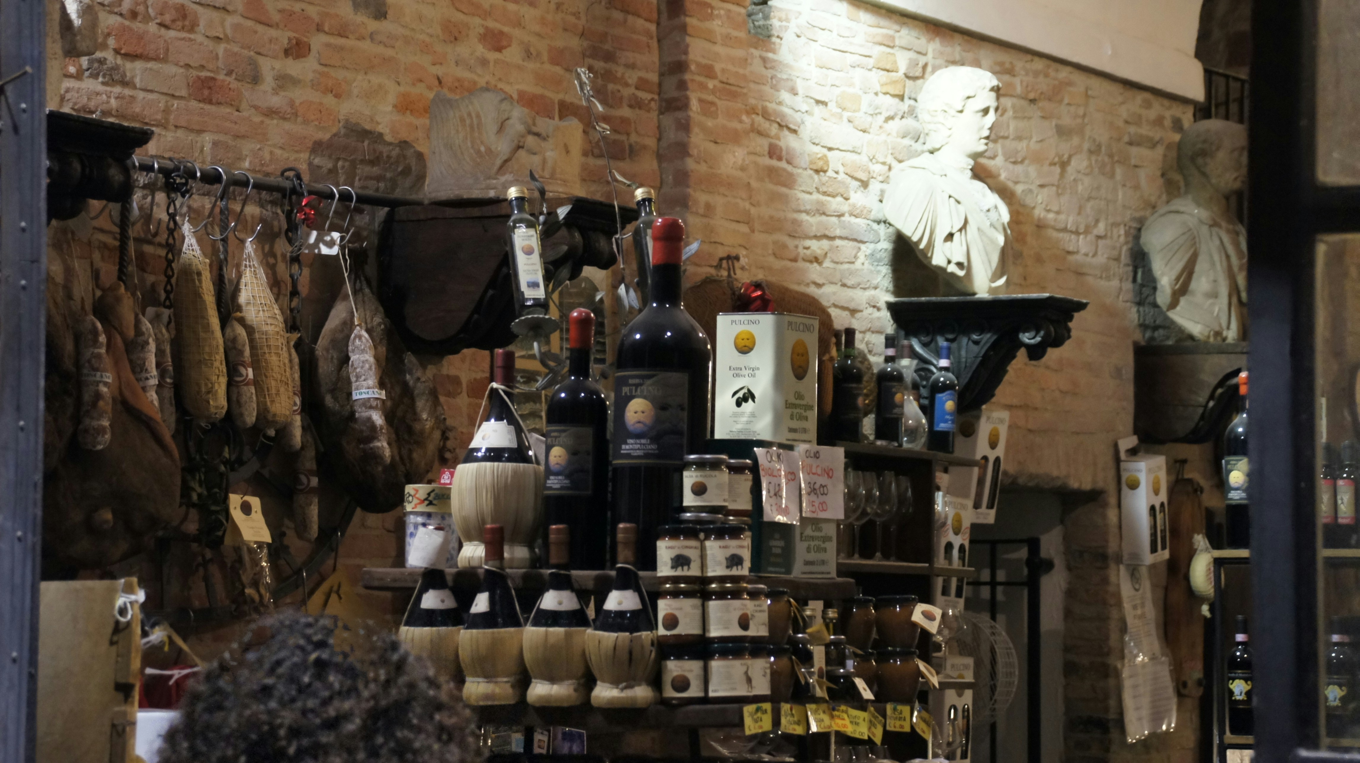 An ancient grocery store in Umbria | A person sitting at a table in a store