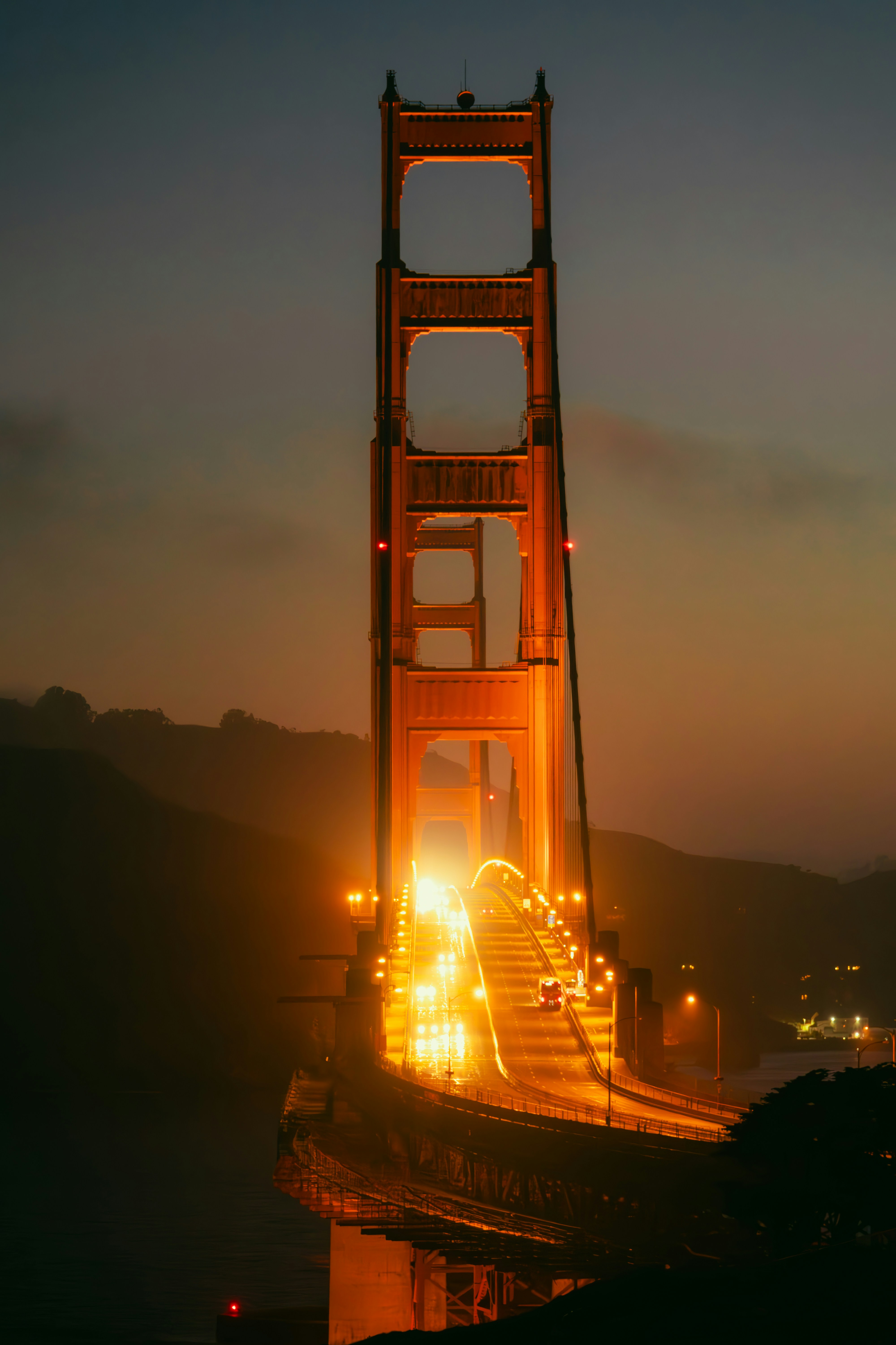 The golden gate bridge is lit up at night photo – Free Bridge Image on ...