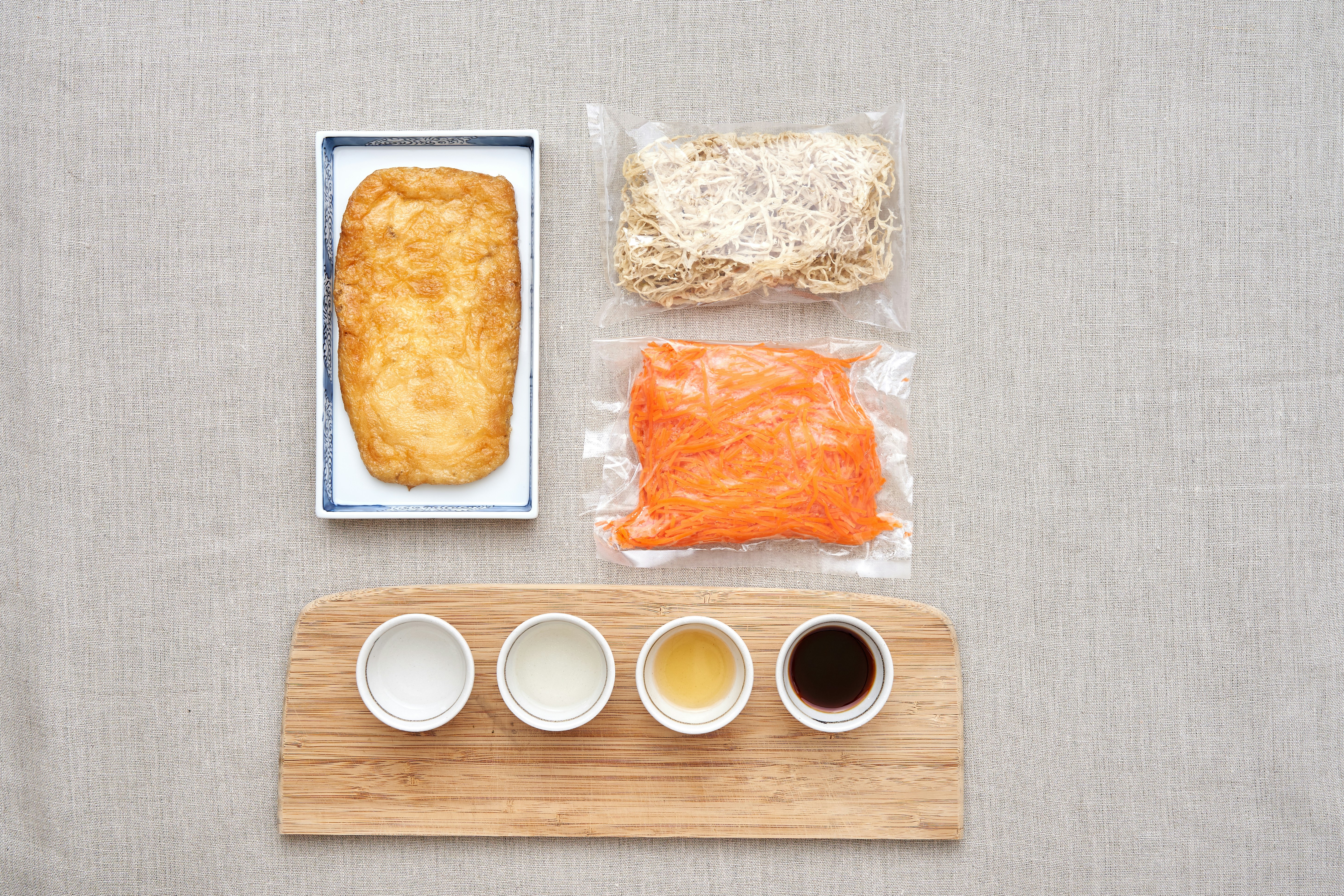 Quiet Geometry of a Pantry Still-Life: Pastry, Packaged Items, and Five Sauces
