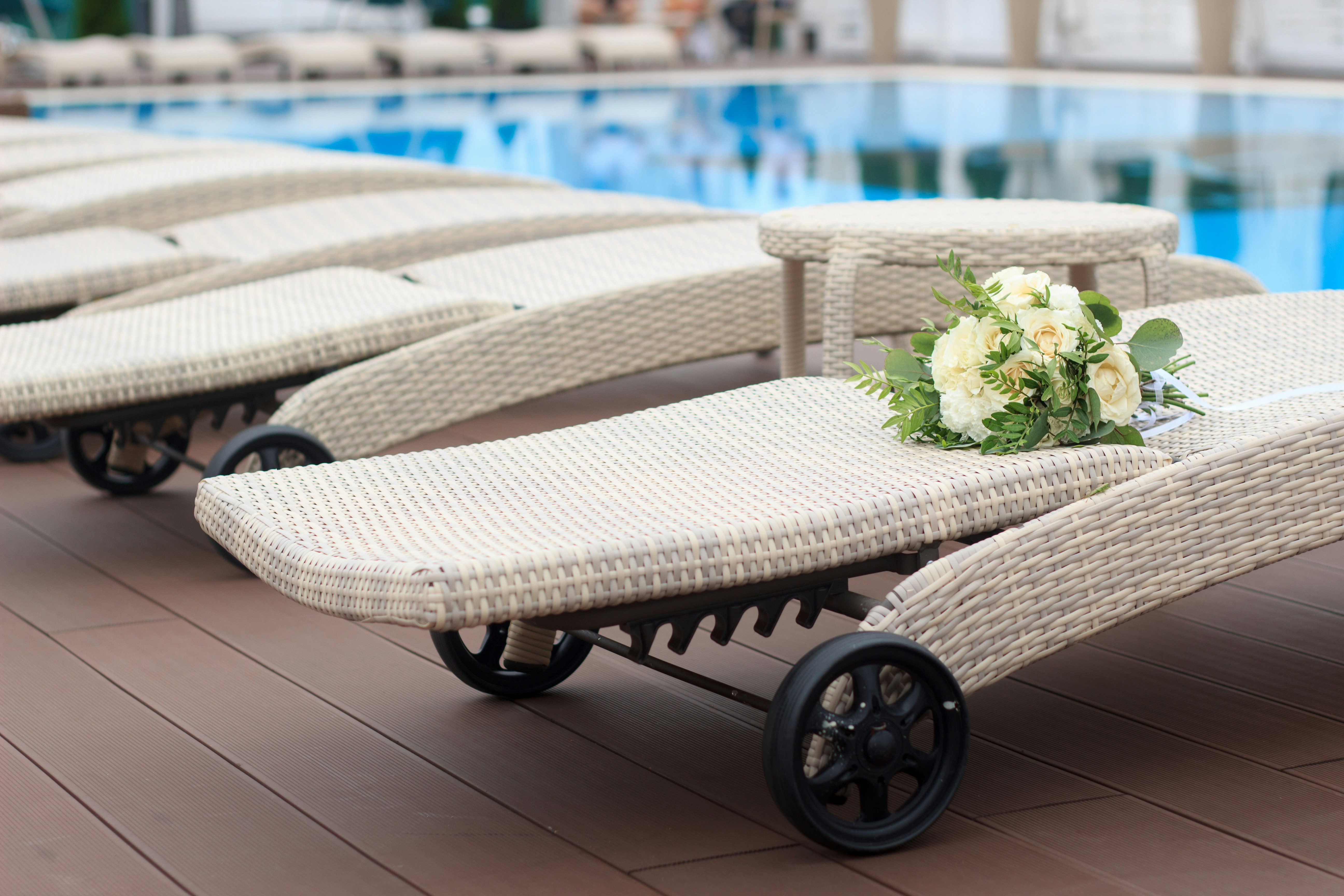 Bouquet on a Poolside Chaise: Quiet Luxury by the Water