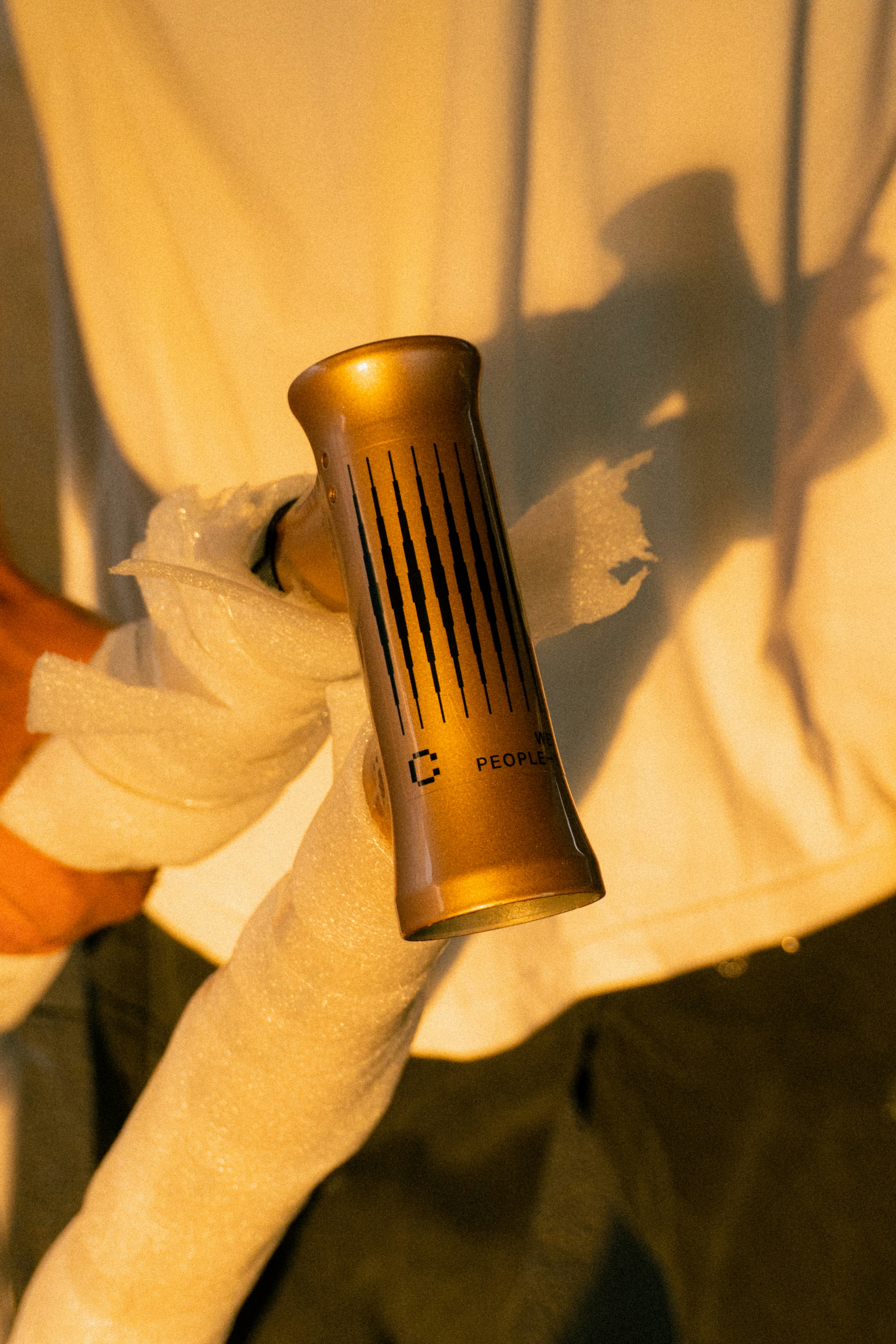 Copper Capsule with Vertical Slats in Warm Studio Light