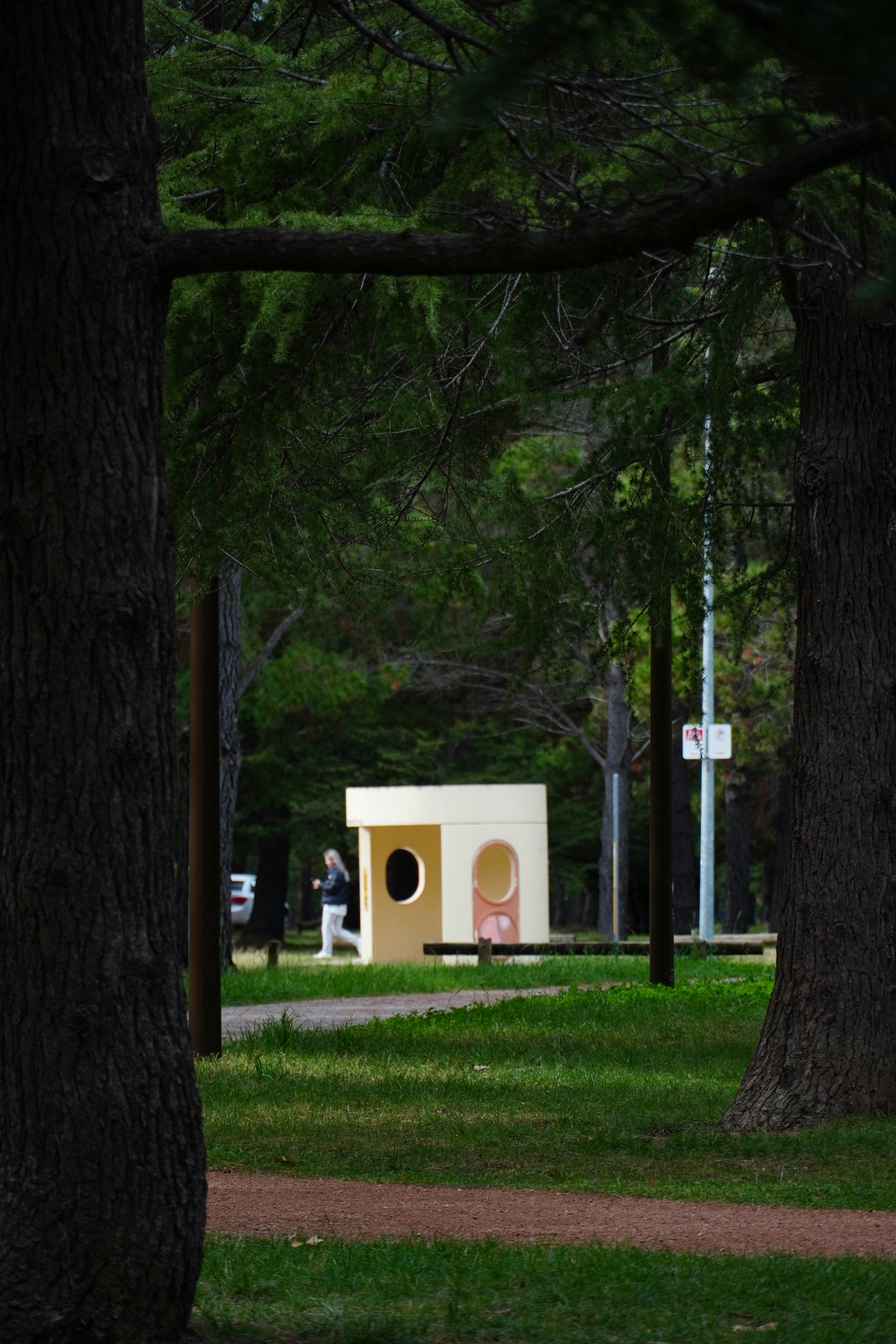 A park with trees and a small structure in the middle of it photo ...