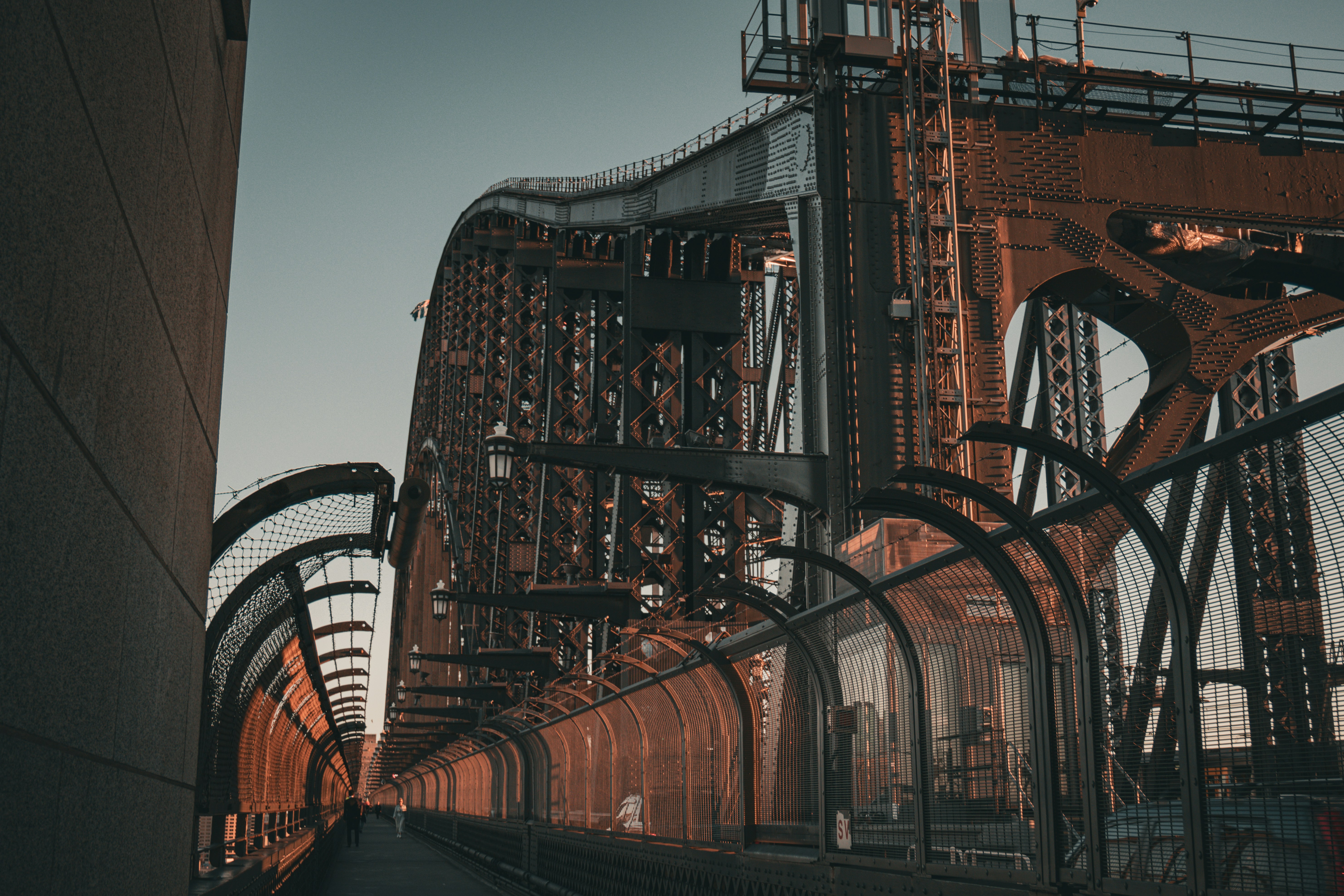 Curved Fences, Vanishing Rails: A Moody Walk Through a Steel-Span Bridge