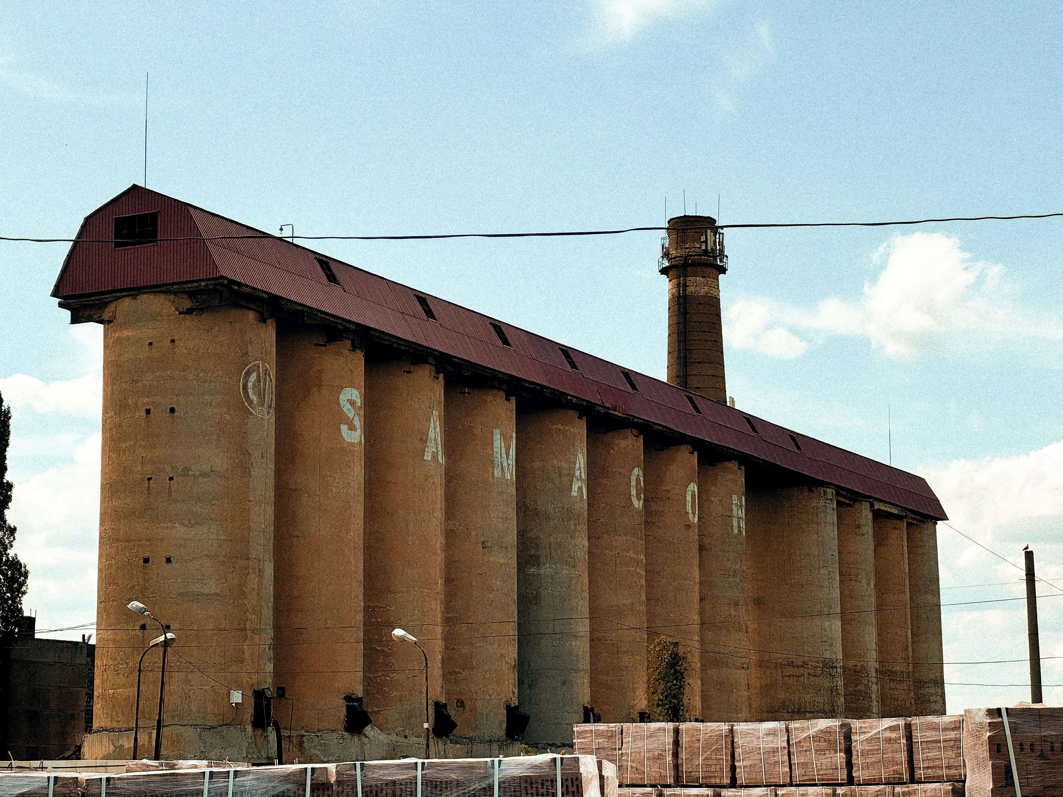 Brick Silo Row Under a Clear Prairie Sky