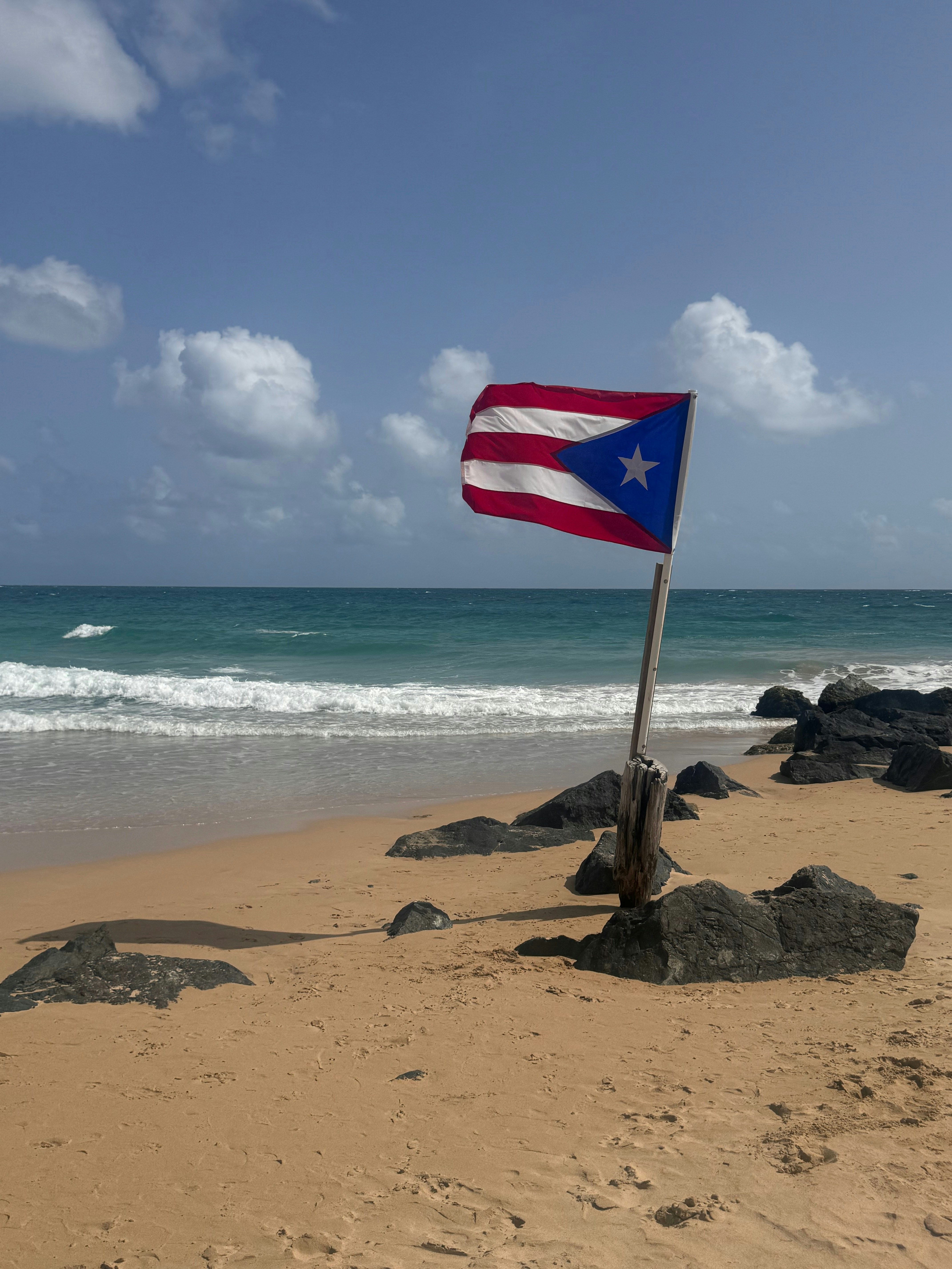 Puerto Rican Flag Standing Guard on a Wind-Swept Caribbean Beach