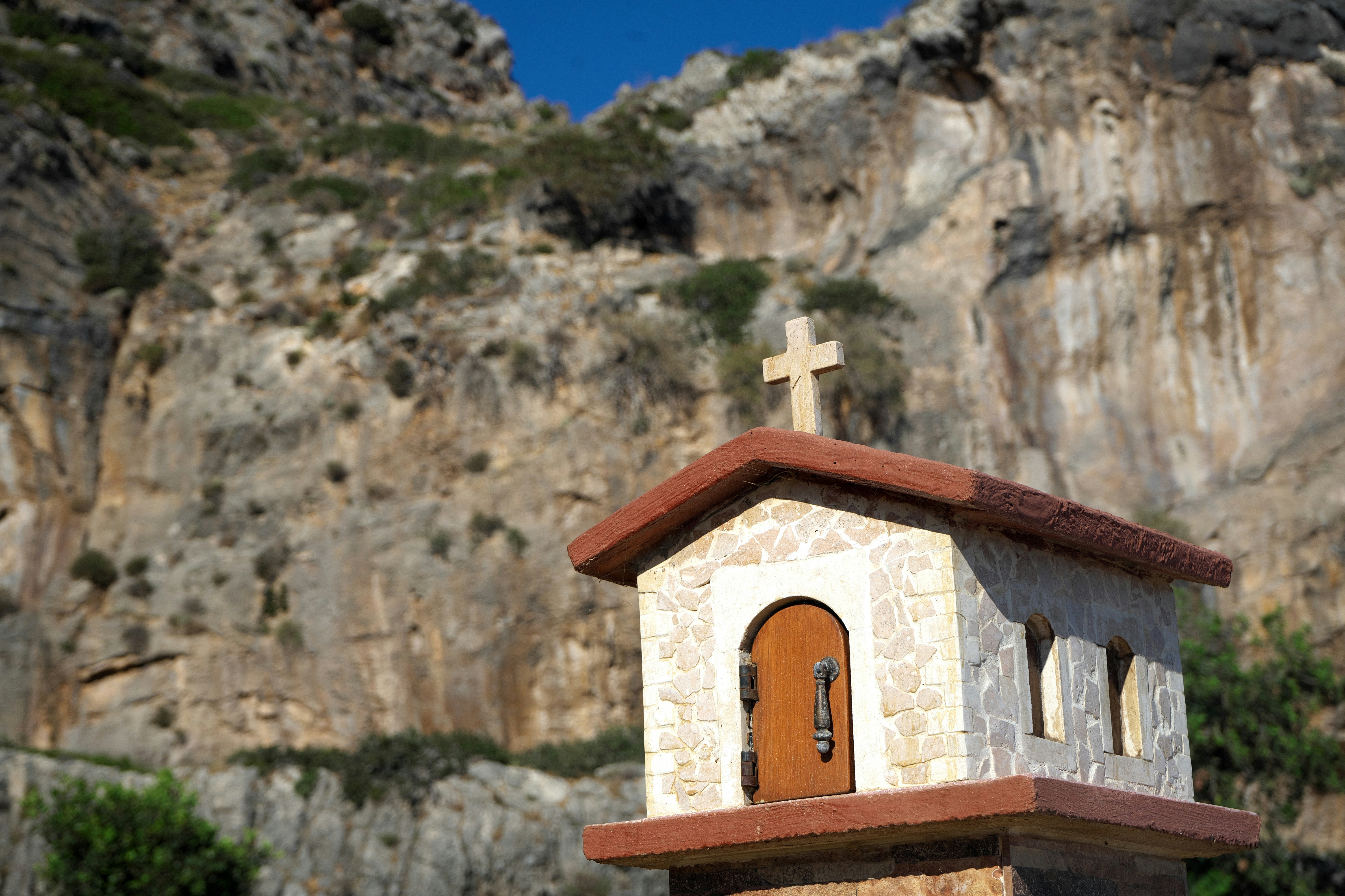 Cliffside Shrine: A Stone Beacon Before the Limestone Wall