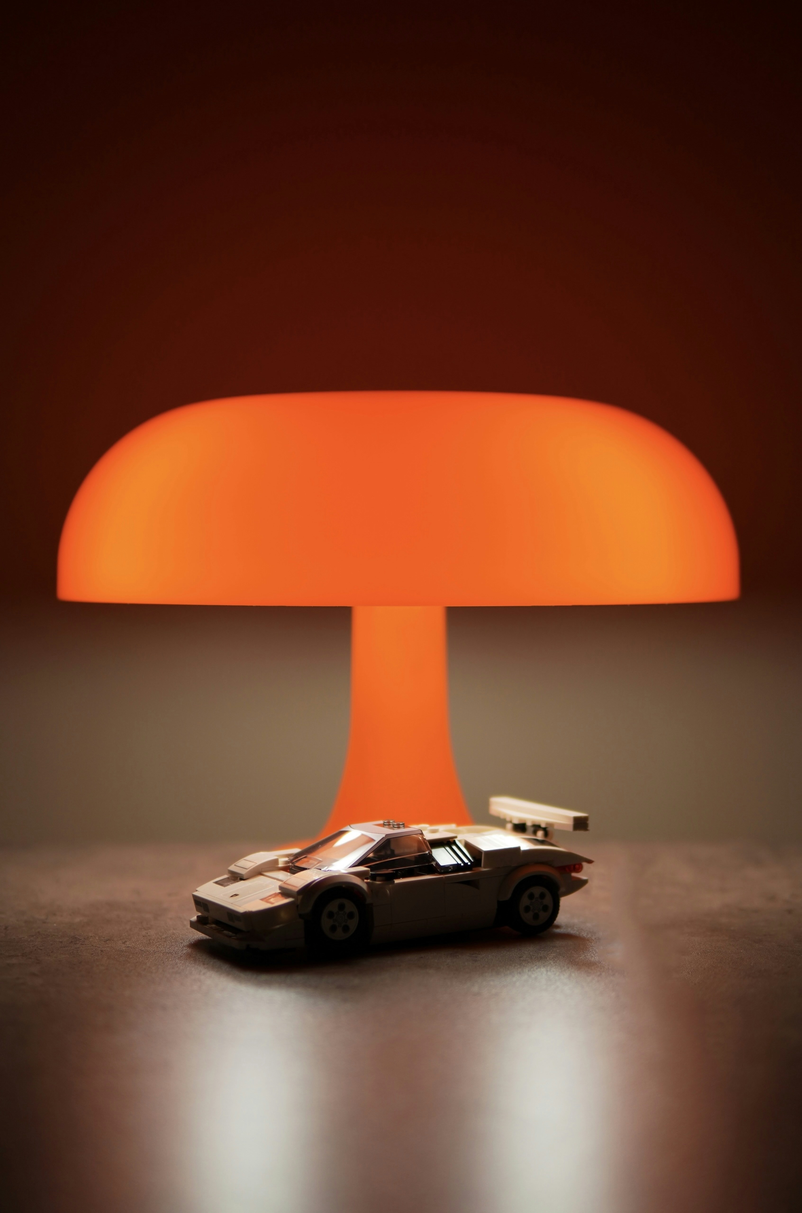 Miniature Racer Beneath an Orange Mushroom Lamp Halo