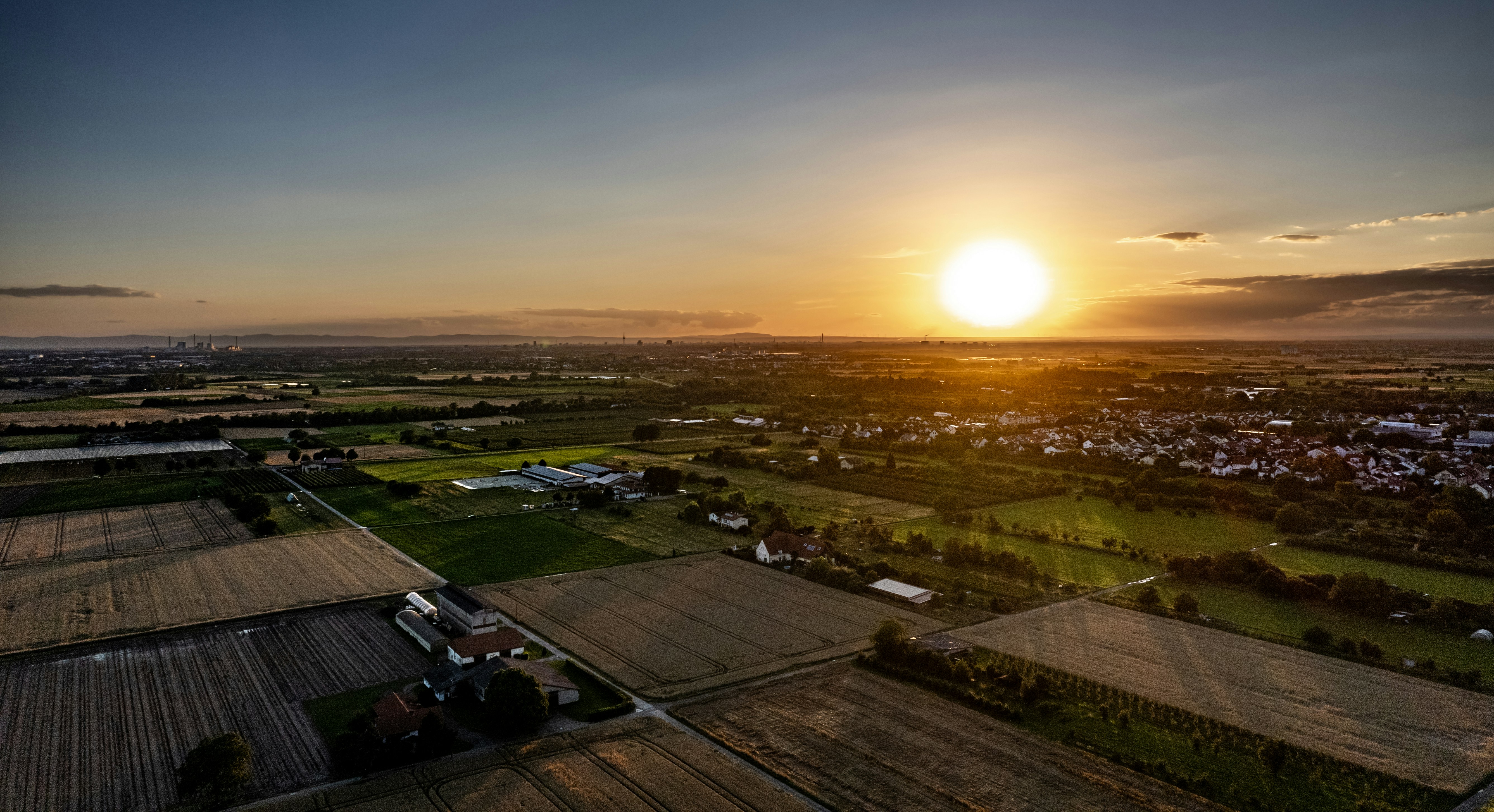 The sun is setting over a farm land photo – Free Schriesheim Image on ...