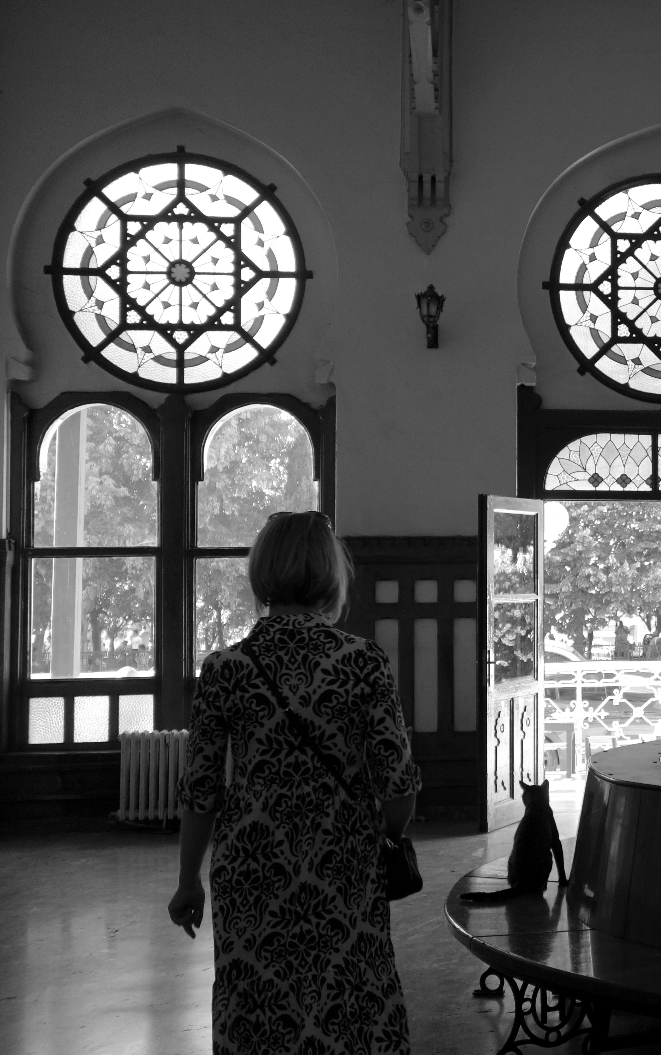 Threshold of Light: A Woman in a Circular-Window Hall