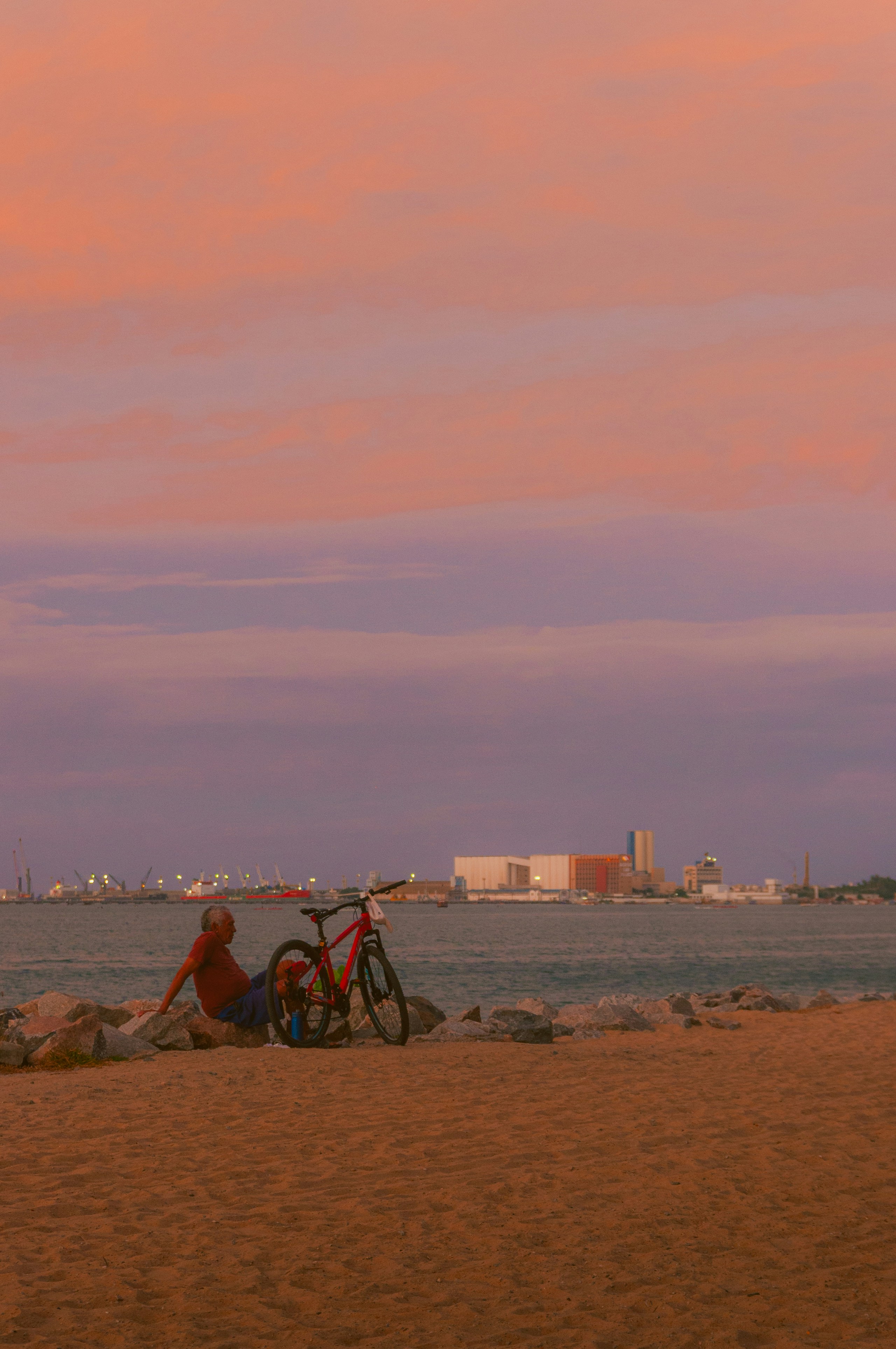 Sunset by the Quiet Shore: Biker Rest at Dusk