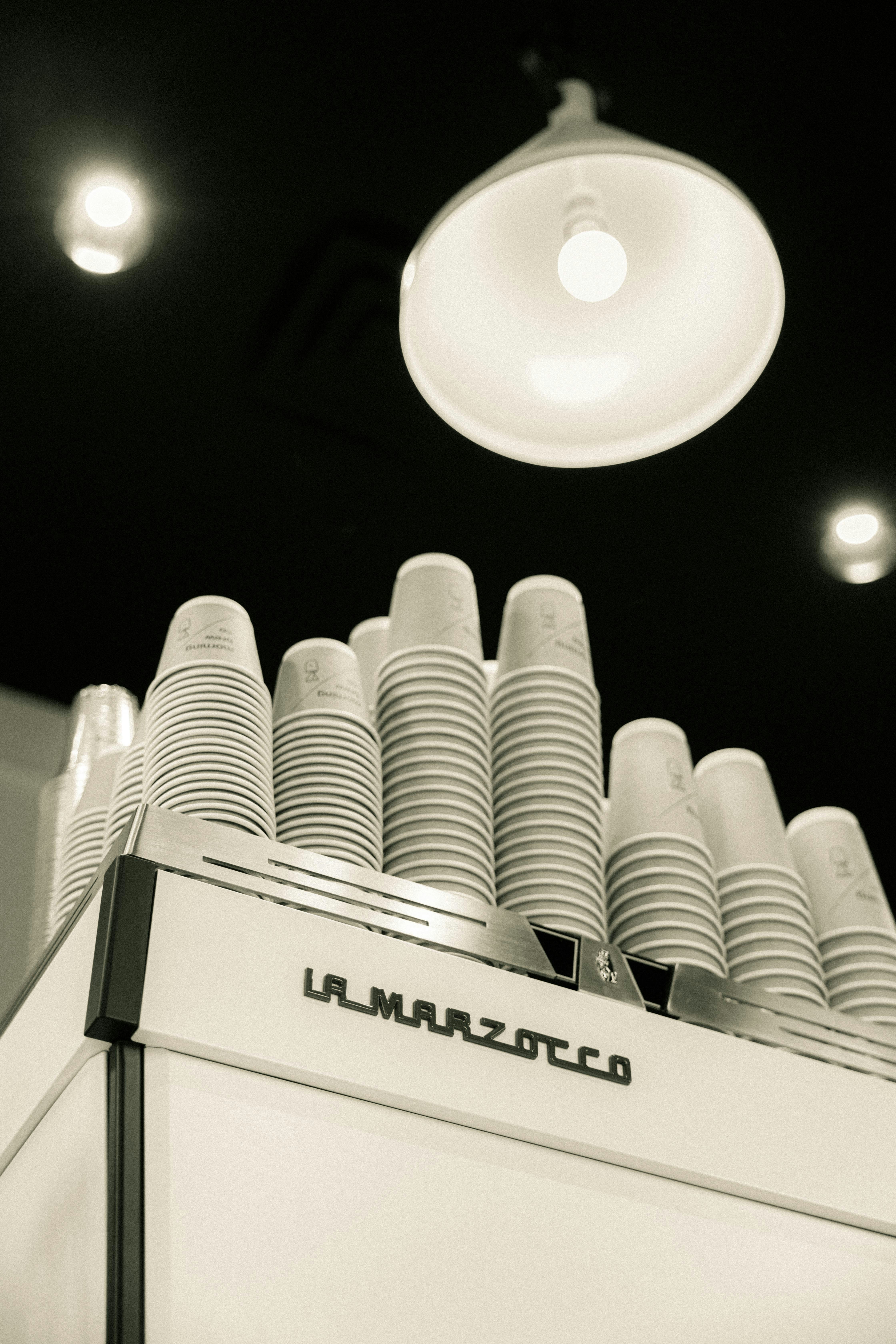 Industrial Grace: The Stacked Cups and Soft Spotlight